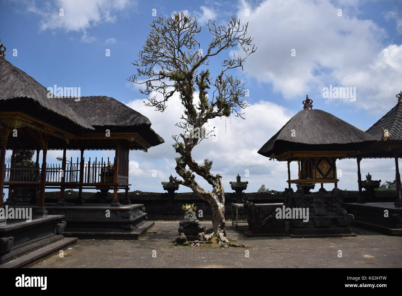 Small structures and an old tree inside Pura Besakih hindu temple in ...