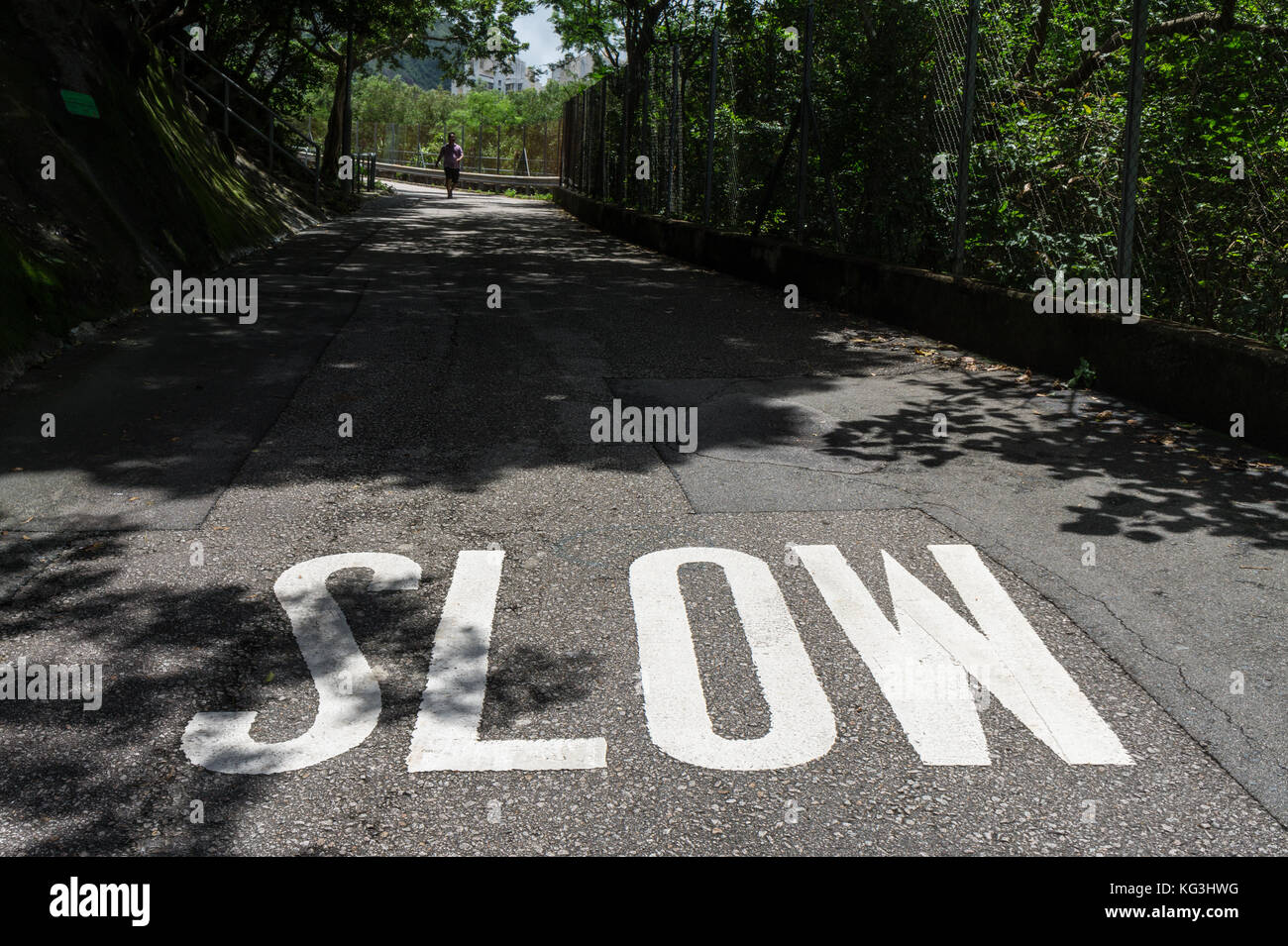 Slow sign painted on road in Hong Kong SAR Stock Photo - Alamy