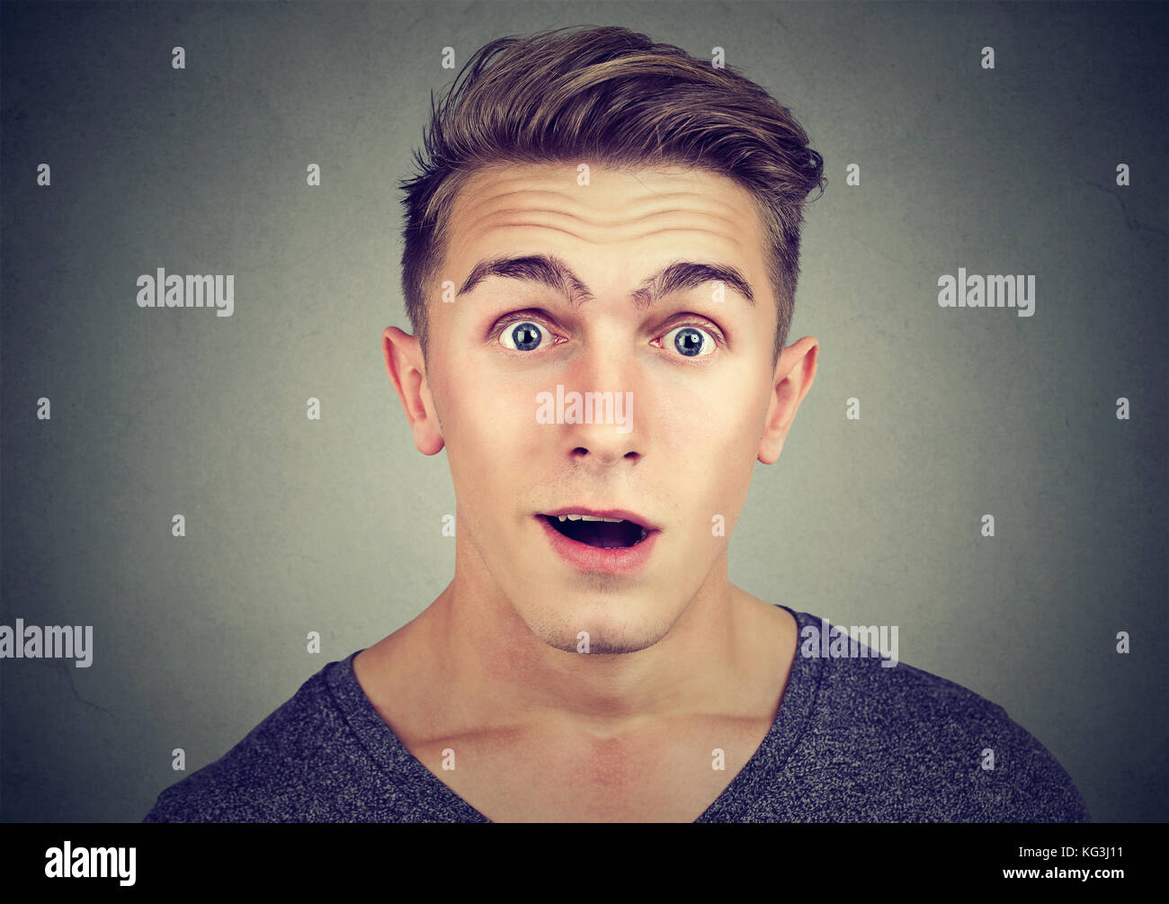 portrait of a surprised young man Stock Photo - Alamy