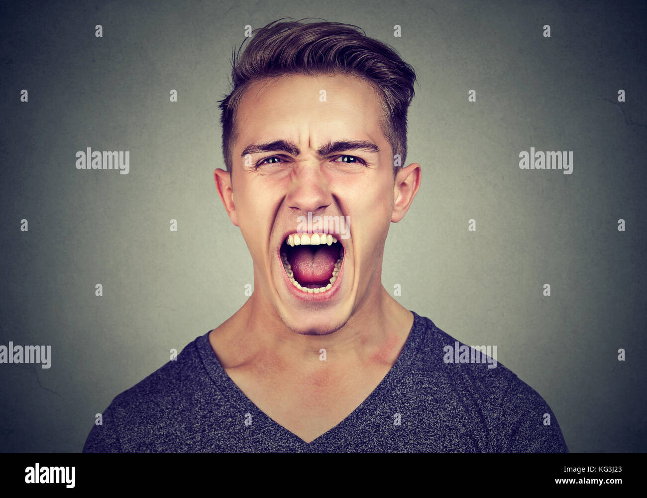 portrait of a young angry man screaming Stock Photo - Alamy