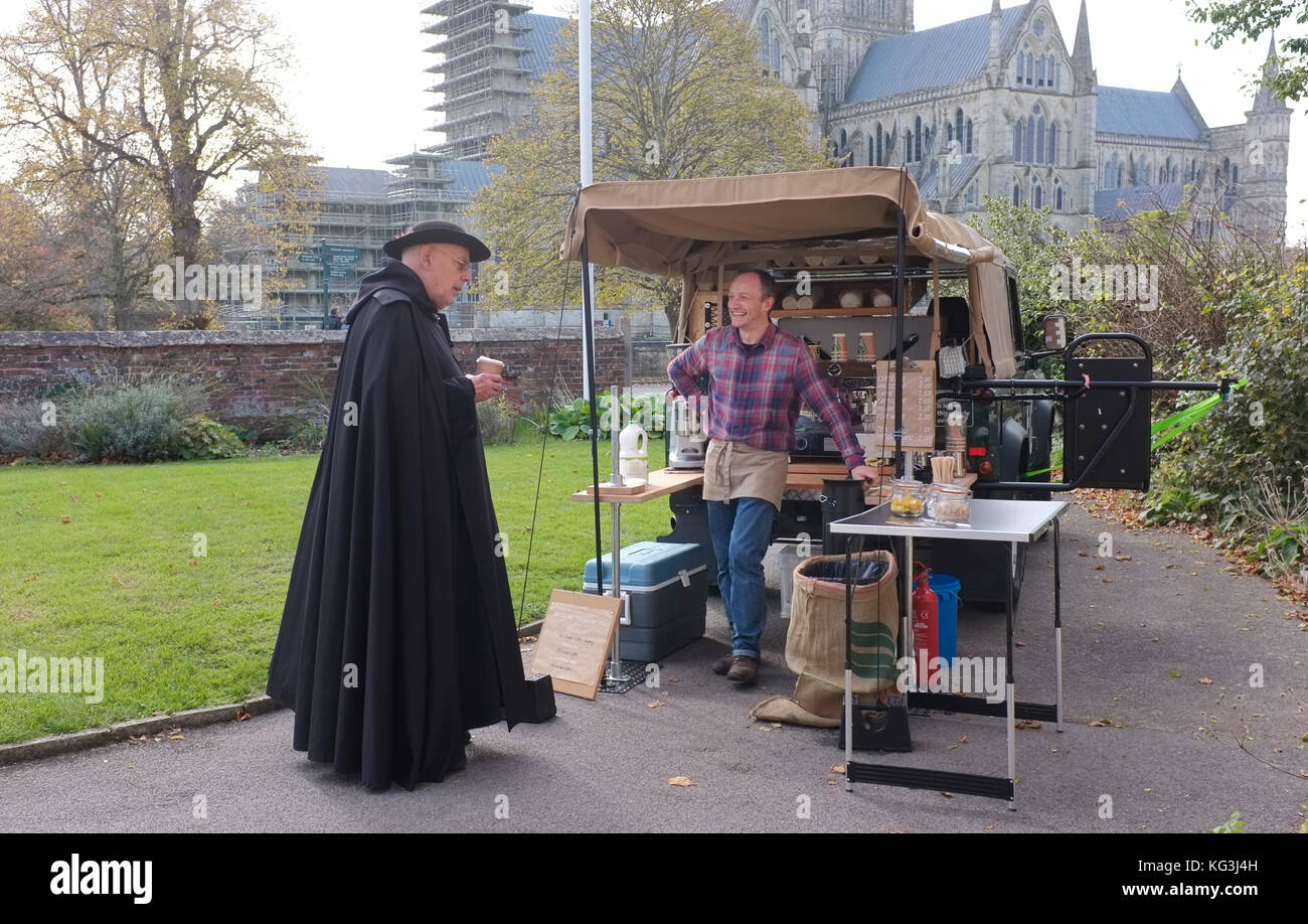 A priest drinking coffee bought from a pop-up coffee stall in Salisbury ...