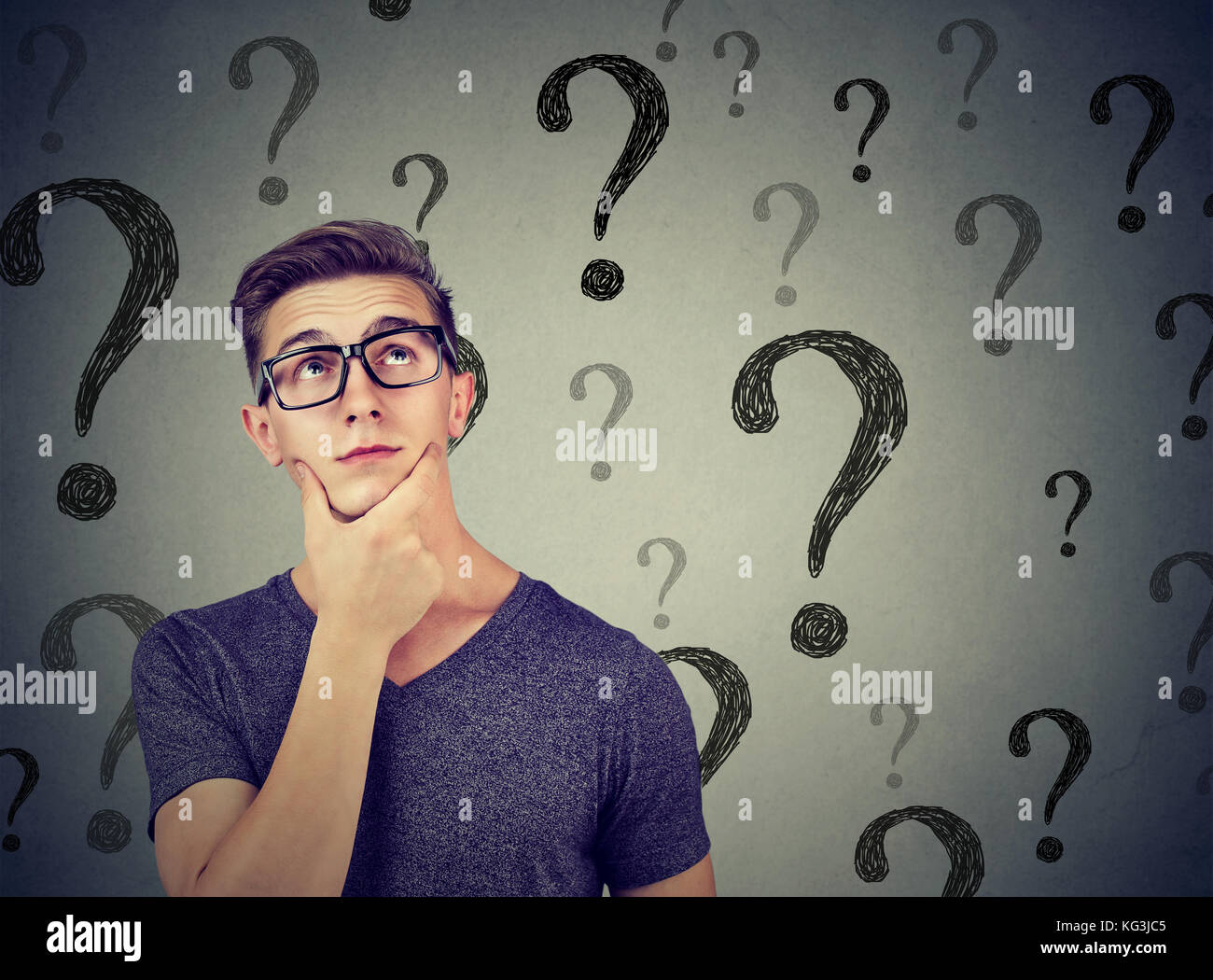 Thoughtful confused handsome man has too many questions and no answer ...