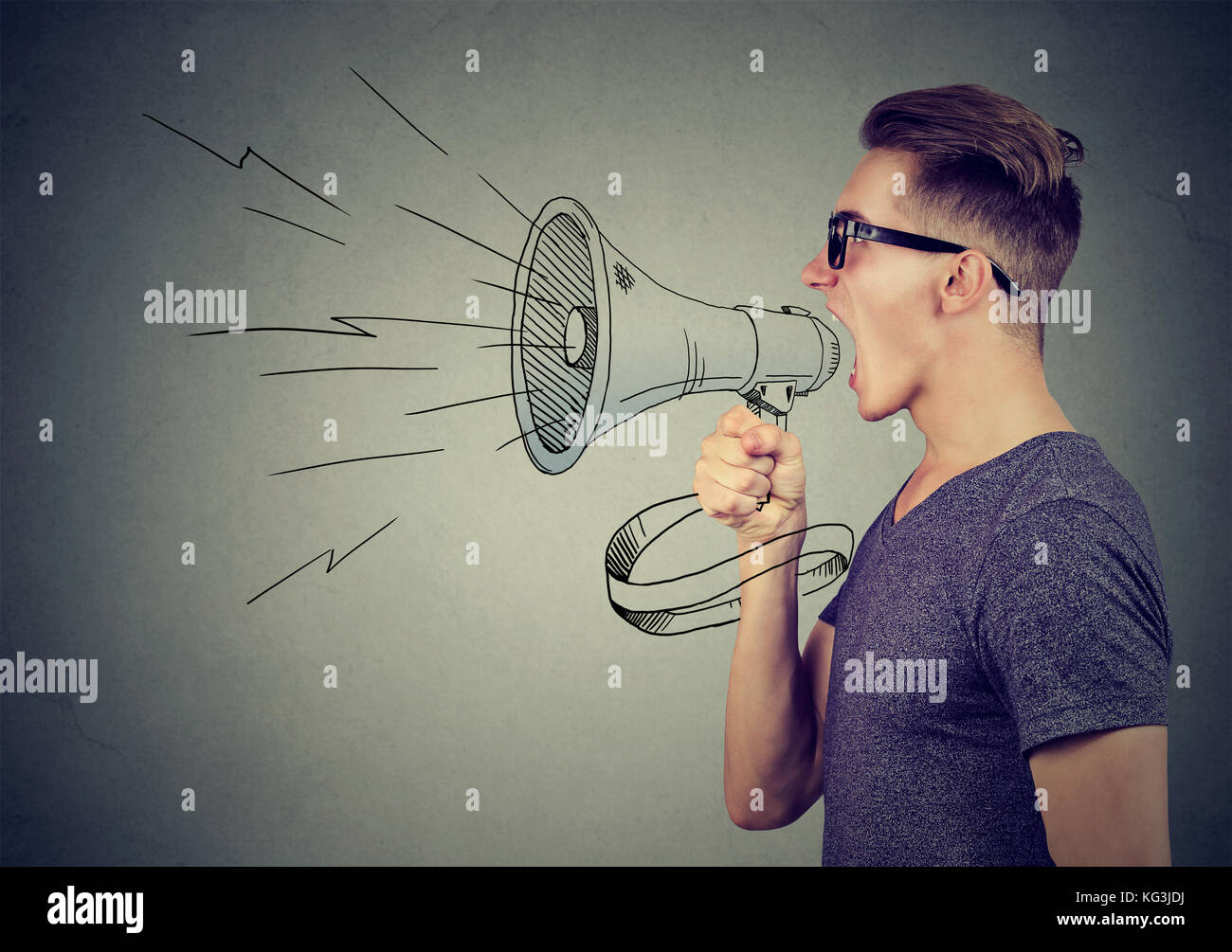 Young man screaming in a megaphone making announcement Stock Photo - Alamy