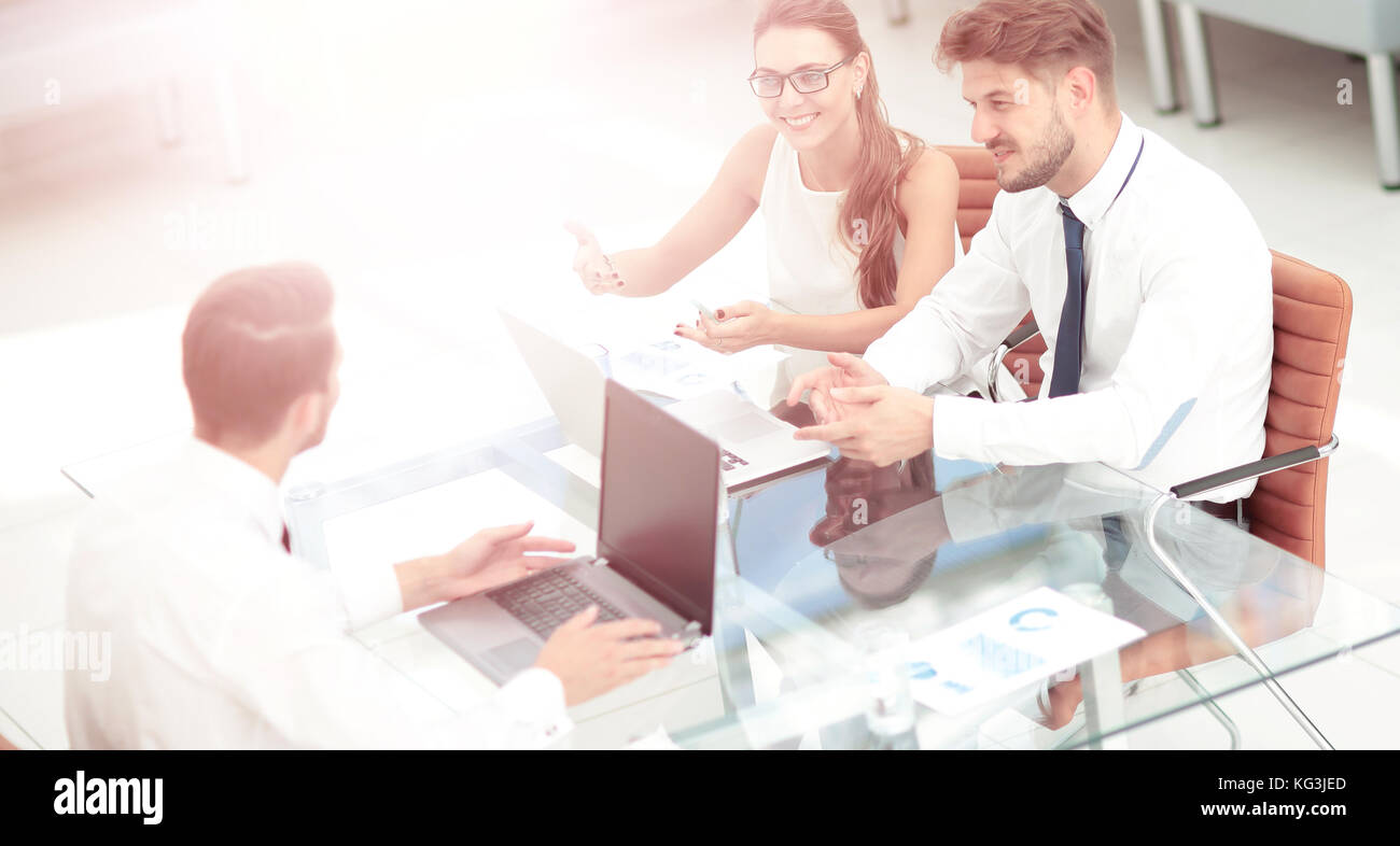 Business people working around table in modern office Stock Photo - Alamy