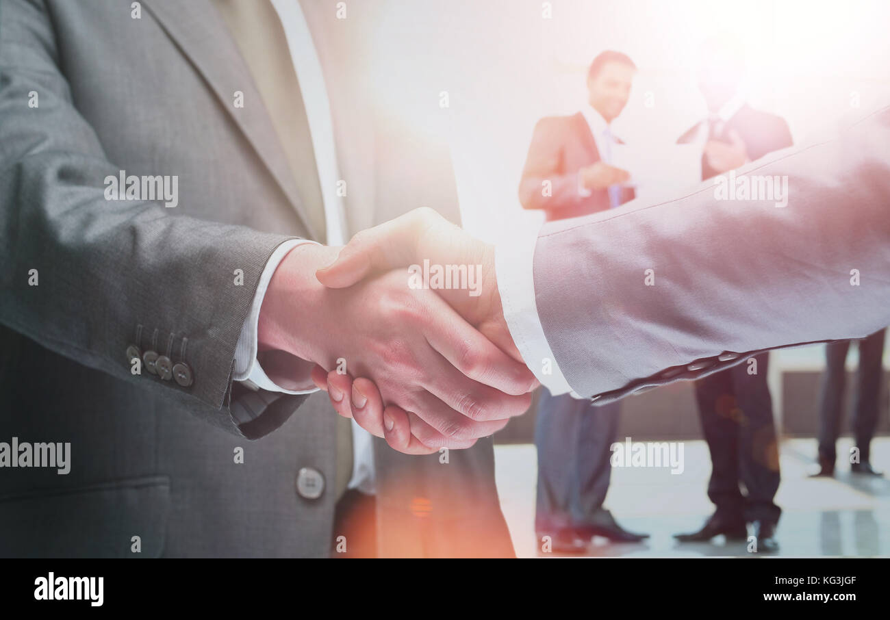 Closeup of a business handshake in office Stock Photo - Alamy