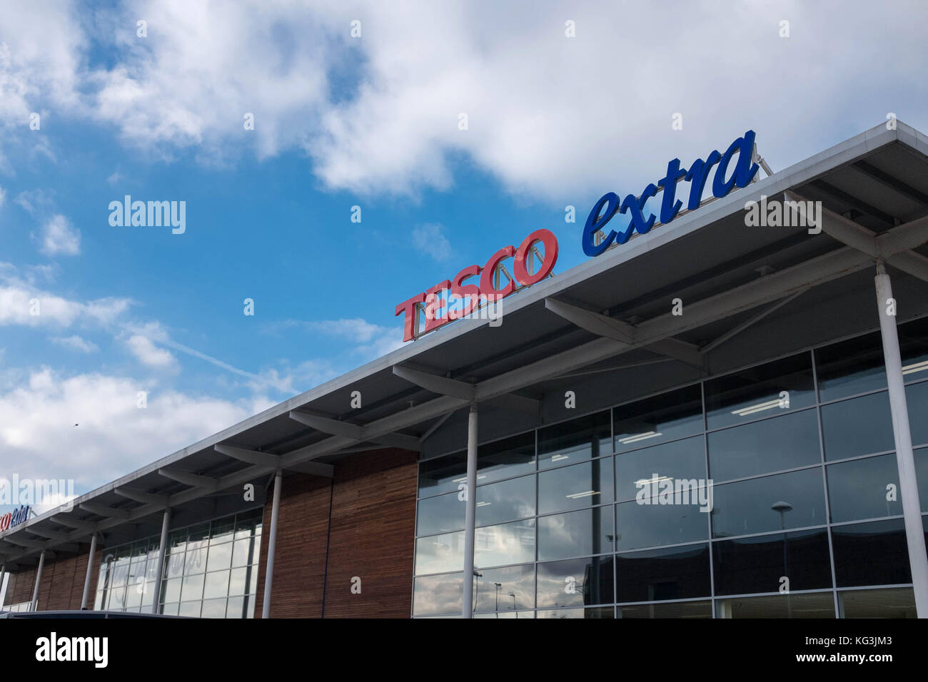 Sign for Tesco Extra store against a blue sky Stock Photo - Alamy