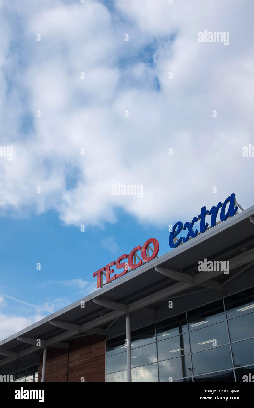 Sign for Tesco Extra store against a blue sky Stock Photo - Alamy