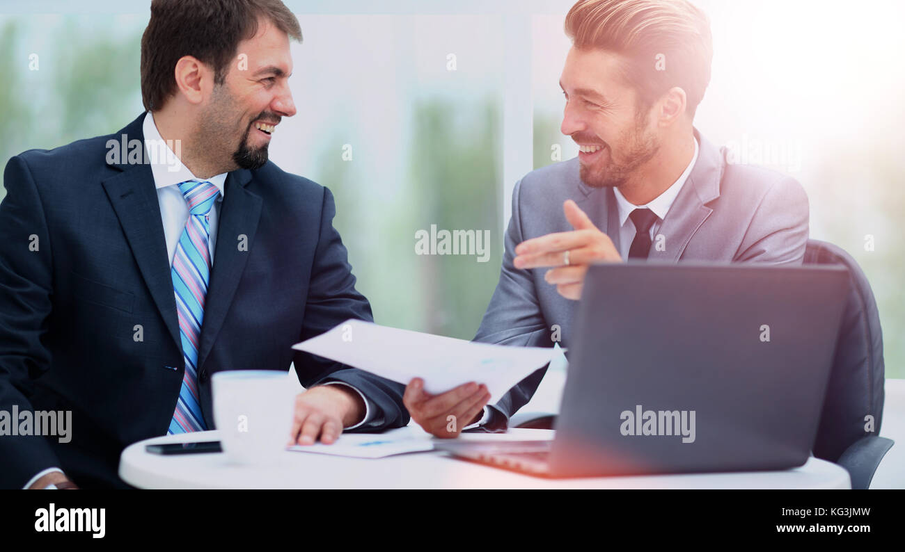 Business men discussing together in an office Stock Photo - Alamy