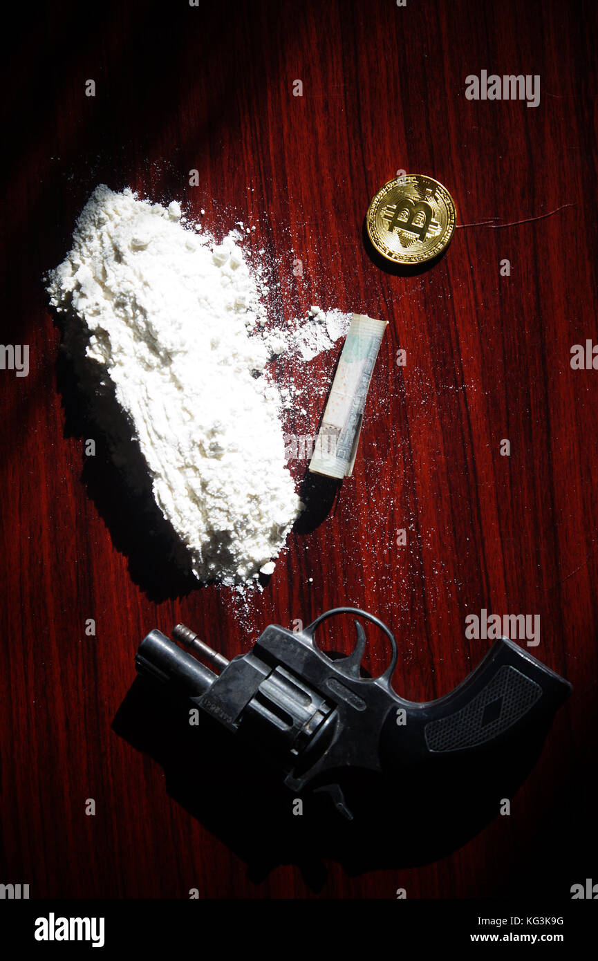 The white powder with a gun and money.Isolated on black background ...