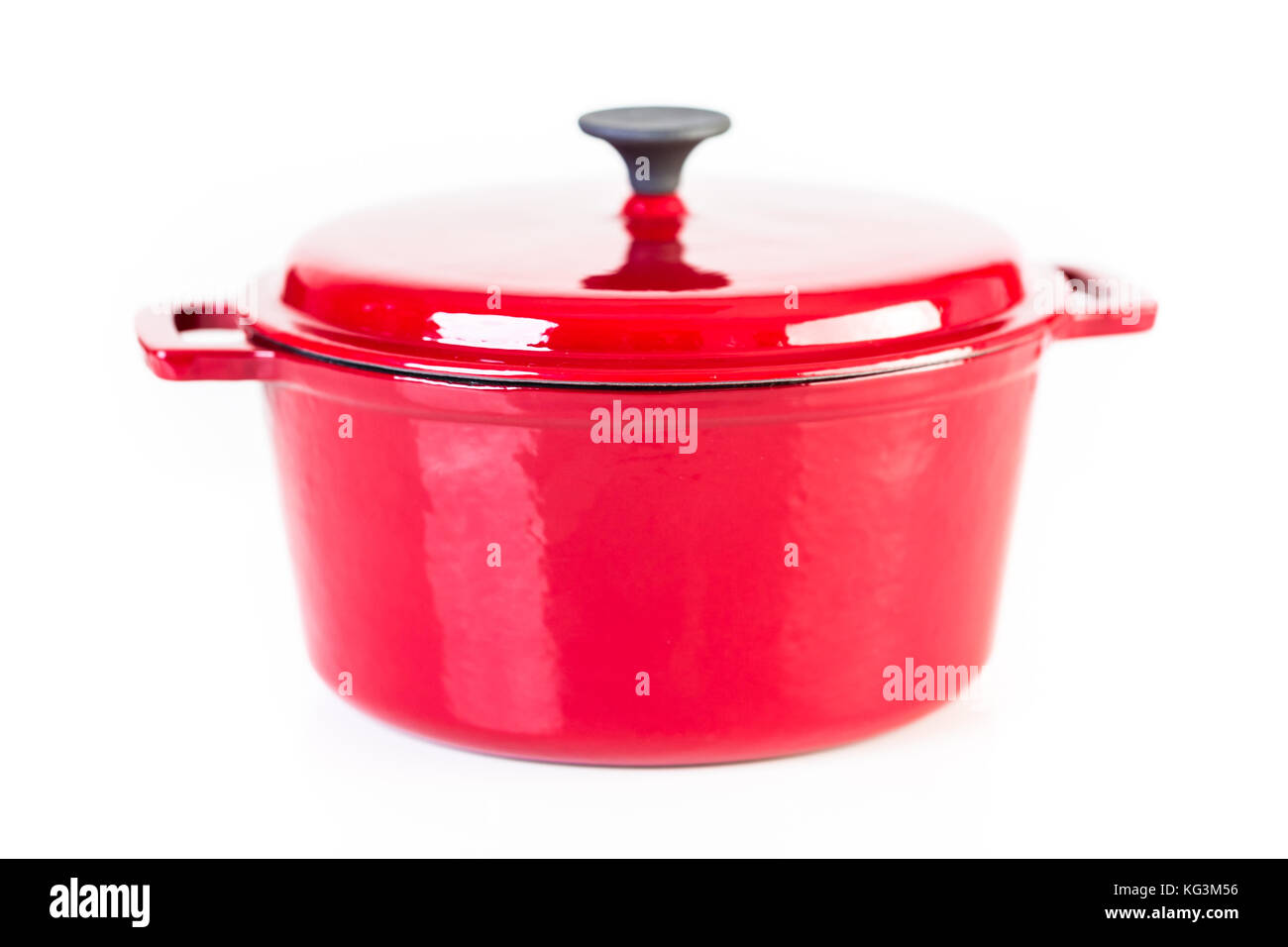 Red enameled cast iron covered dutch oven on a white background Stock ...