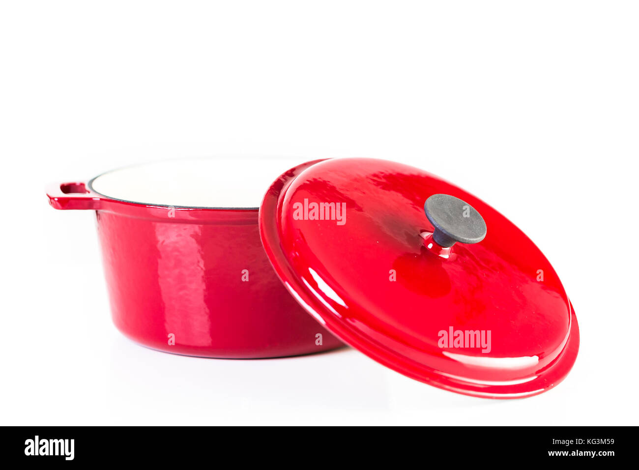 Red enameled cast iron covered dutch oven on a white background Stock ...