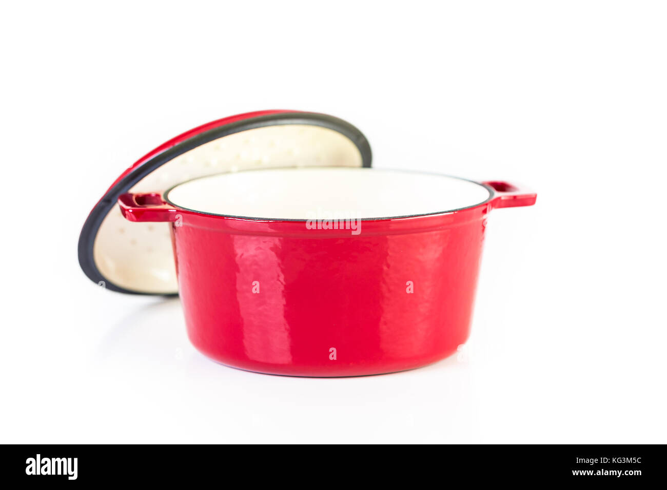 Red enameled cast iron covered dutch oven on a white background Stock ...