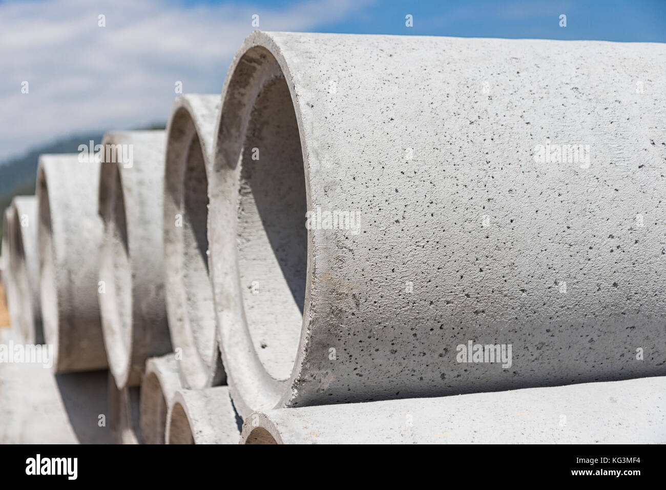 Pipe concrete manholes are stored on the ground ready for construction ...