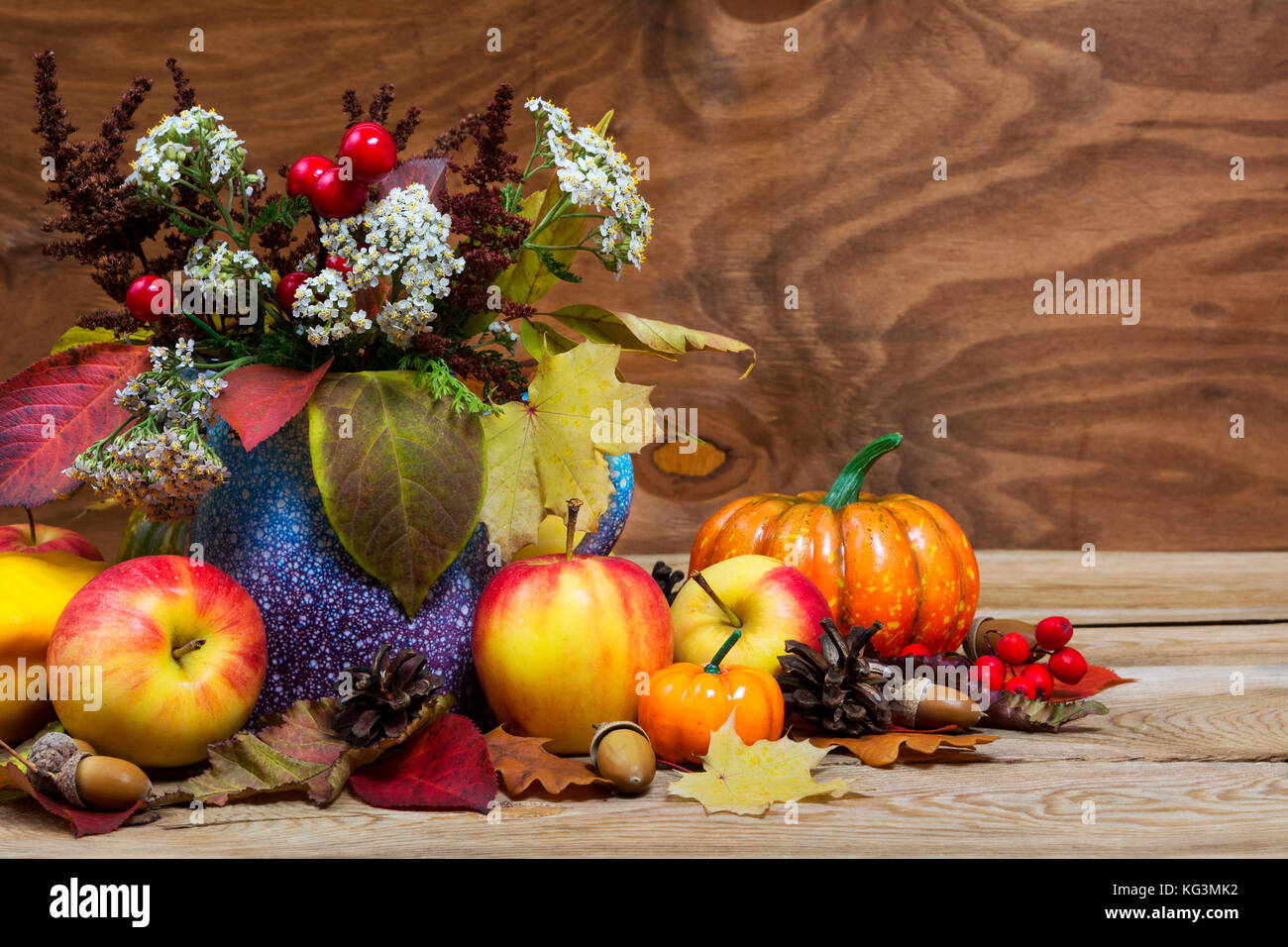 Thanksgiving decoration with red berries, white flowers and leaves in ...