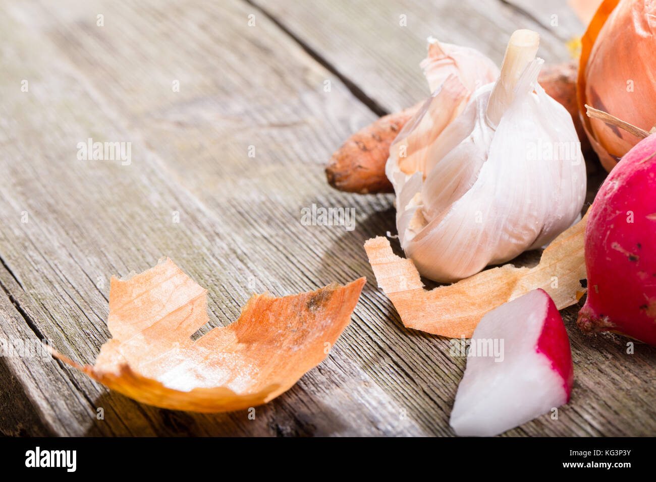 The crude vegetables in the right corner of a background from gray old ...