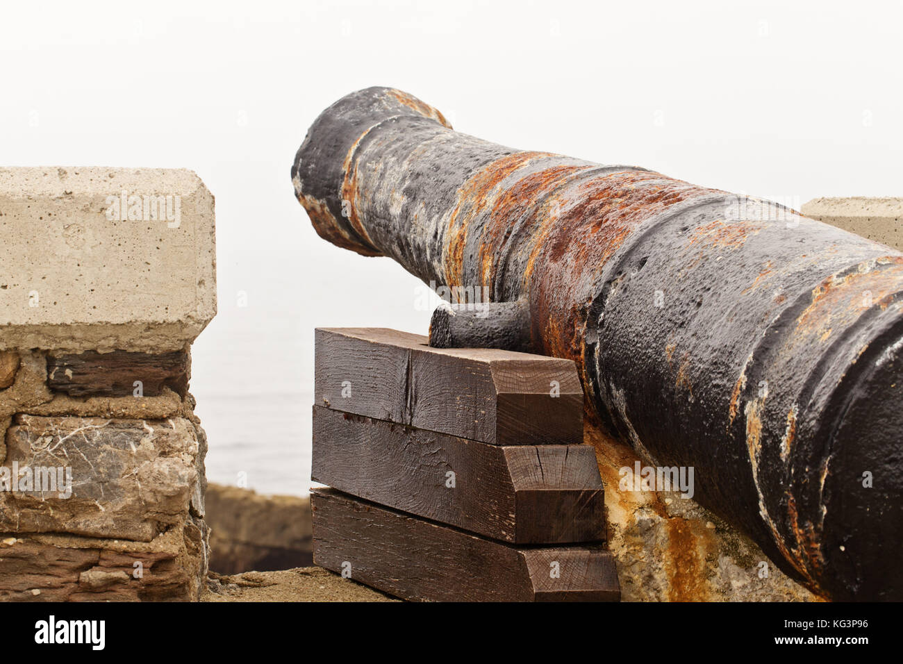 Ancient guns on a fortress wall. Guns are covered with a rust ...
