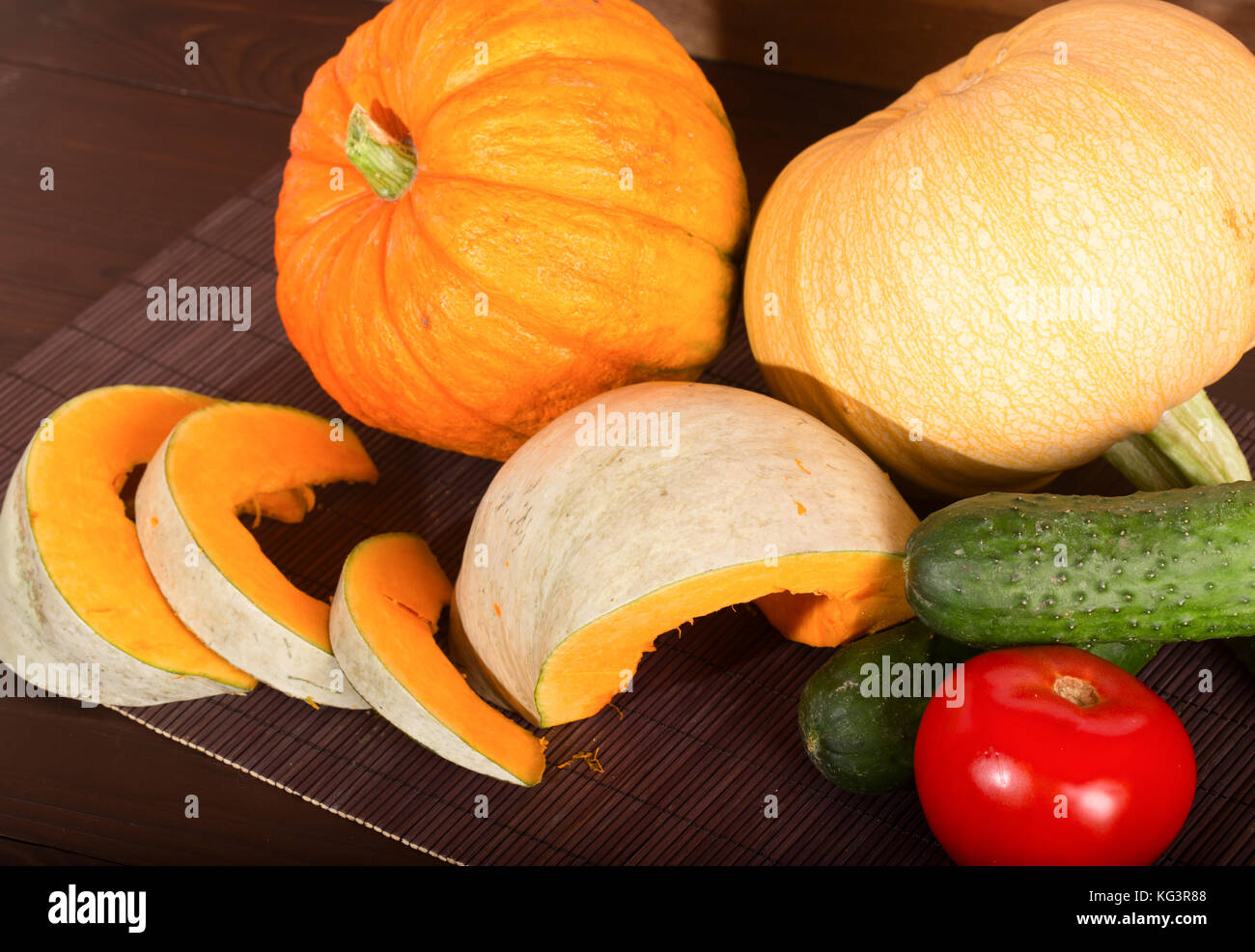 Pumpkin and vegetables - a cucumber and tomato. Three grades of pumpkin ...