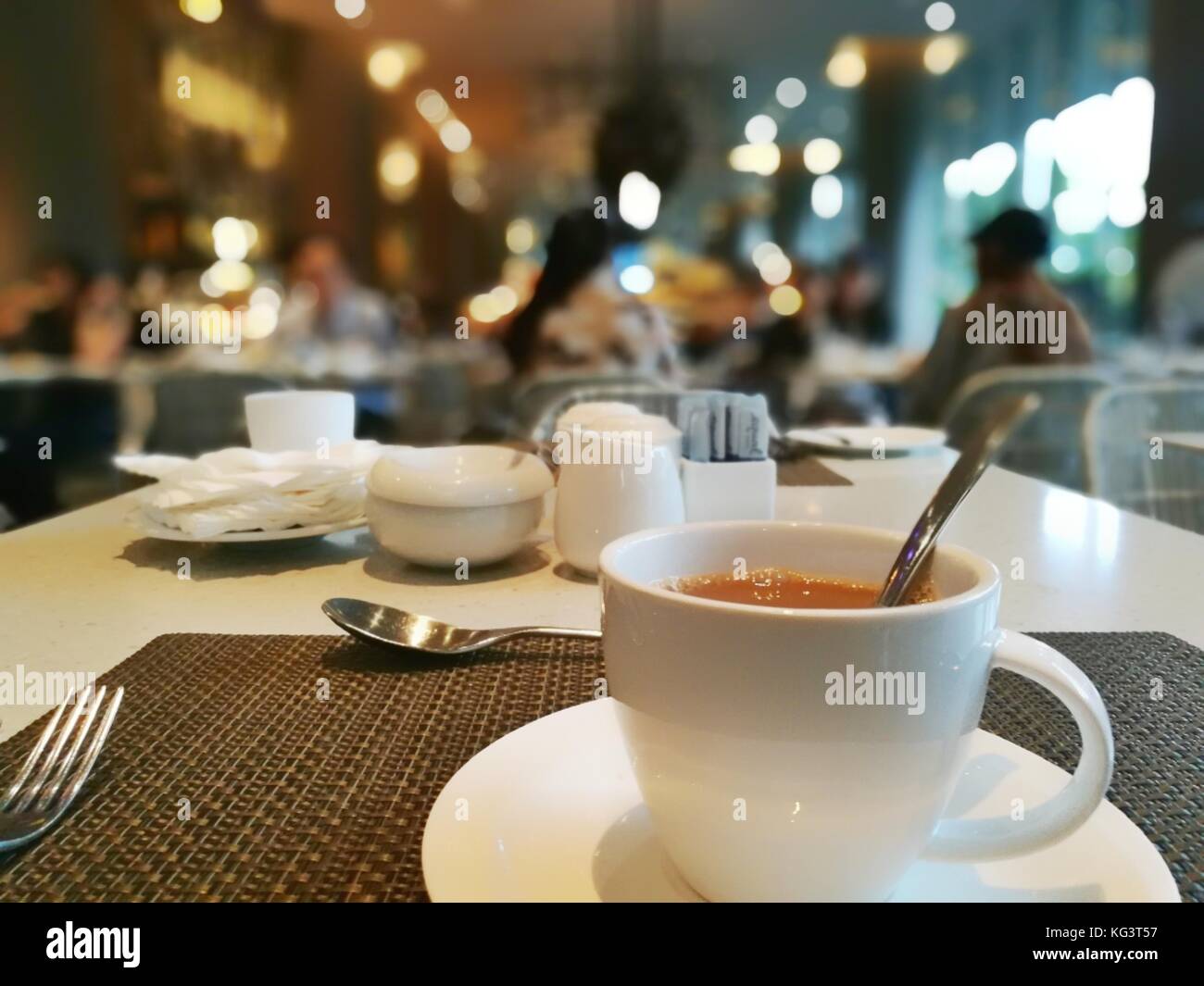 a hot milk coffee cup of coffee in a restaurant Stock Photo - Alamy