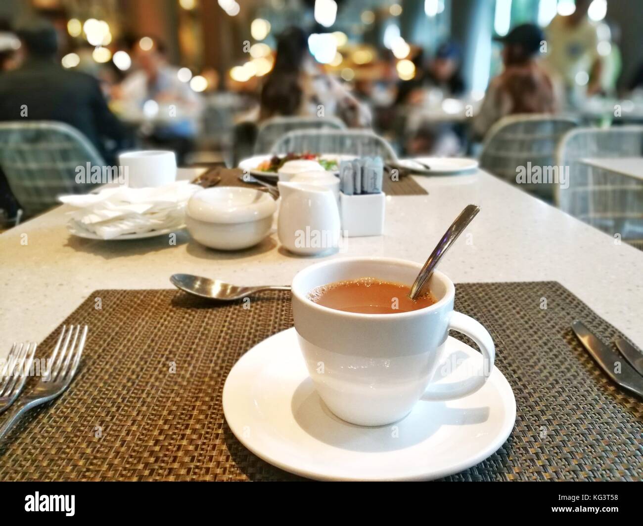 a hot milk coffee cup of coffee in a restaurant Stock Photo - Alamy