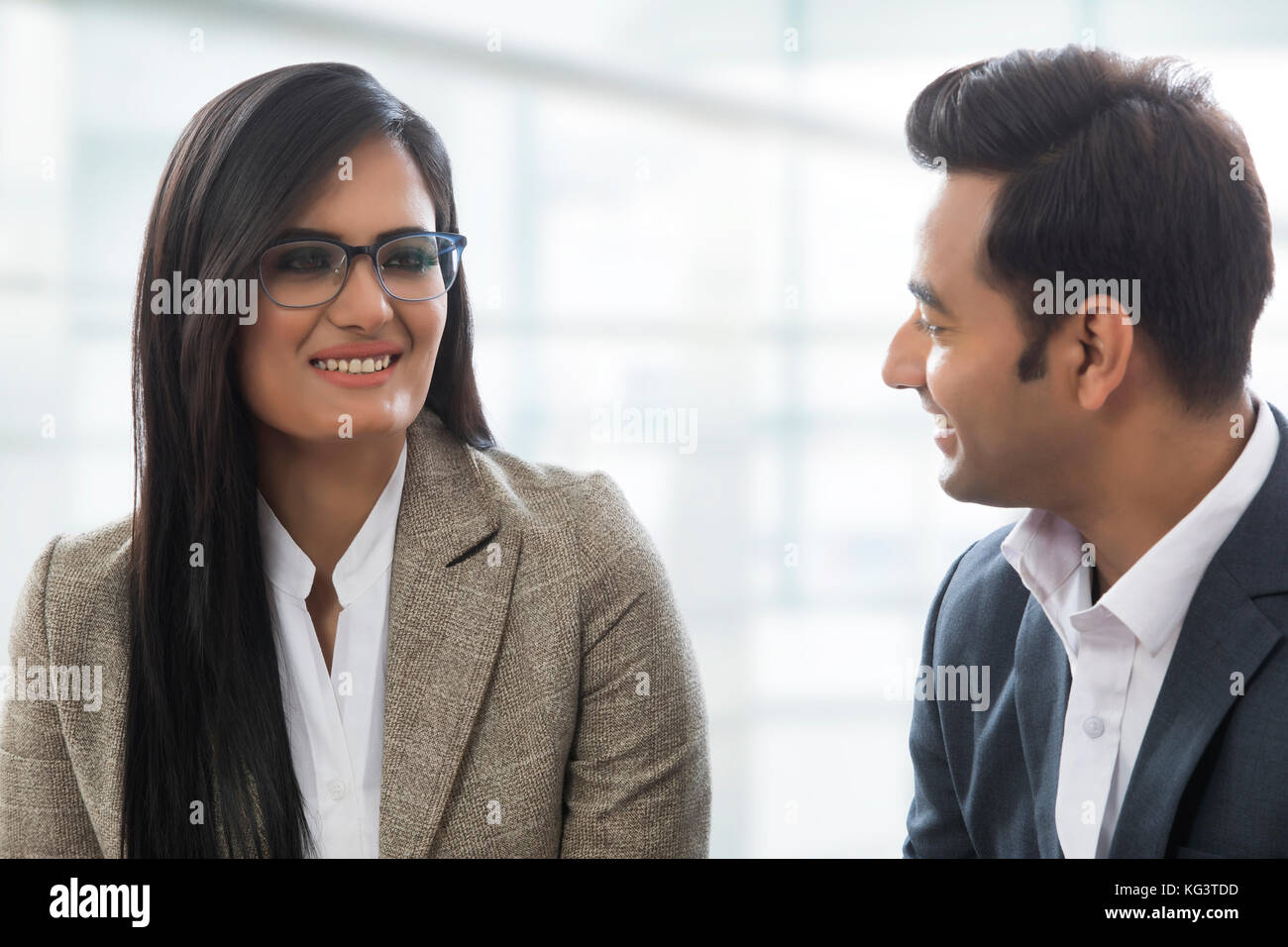 Portrait businessman sitting businesswoman hi-res stock photography and ...