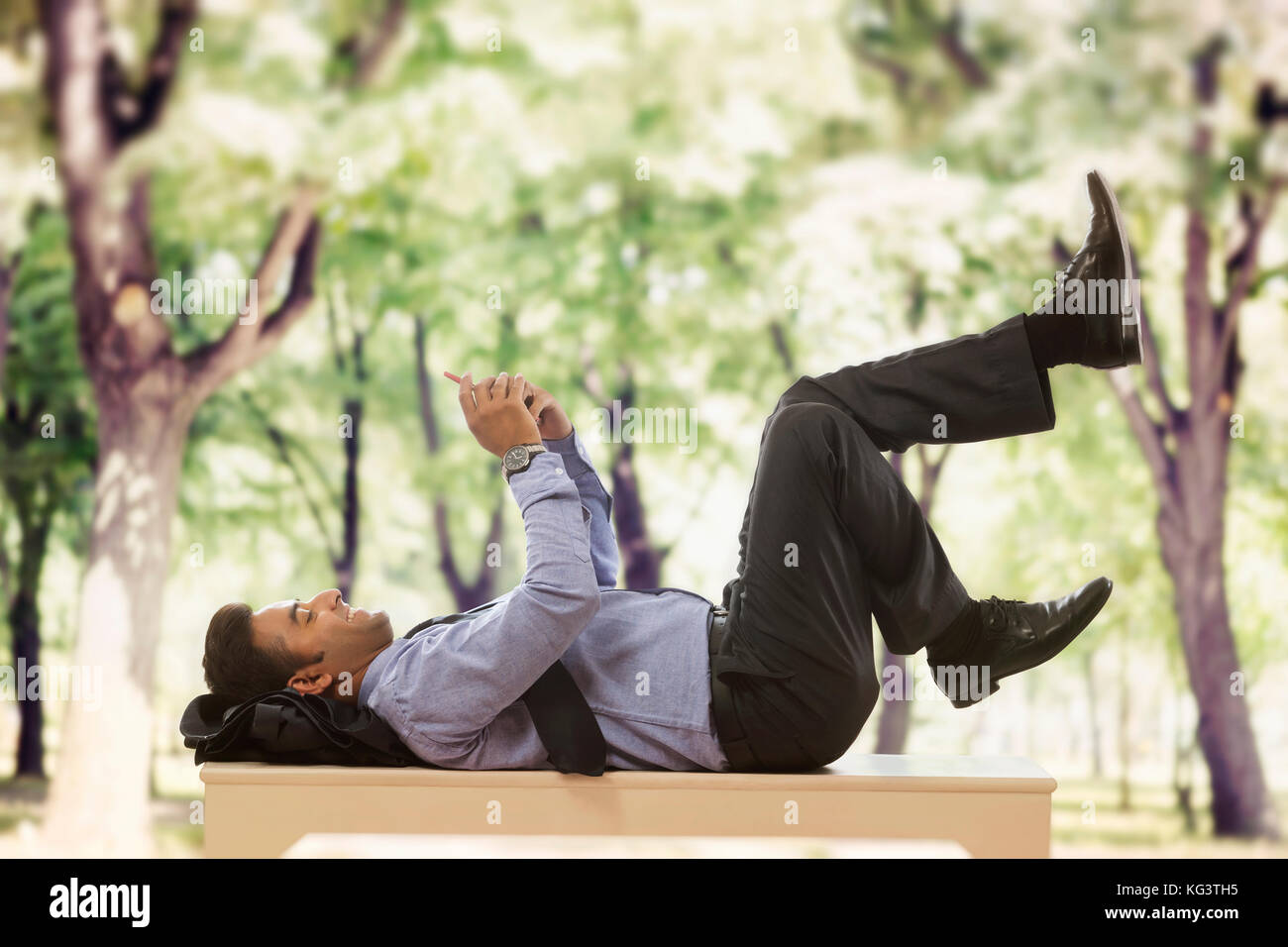 Businessman bench in park back view hi-res stock photography and images ...