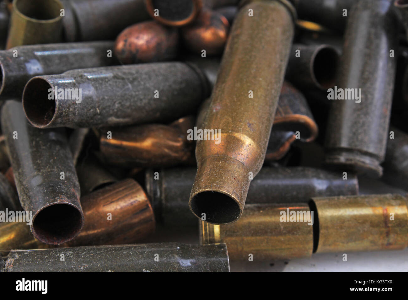 Heap of gun bullets. Weapon Cartridge case sleeve background texture, 7 ...