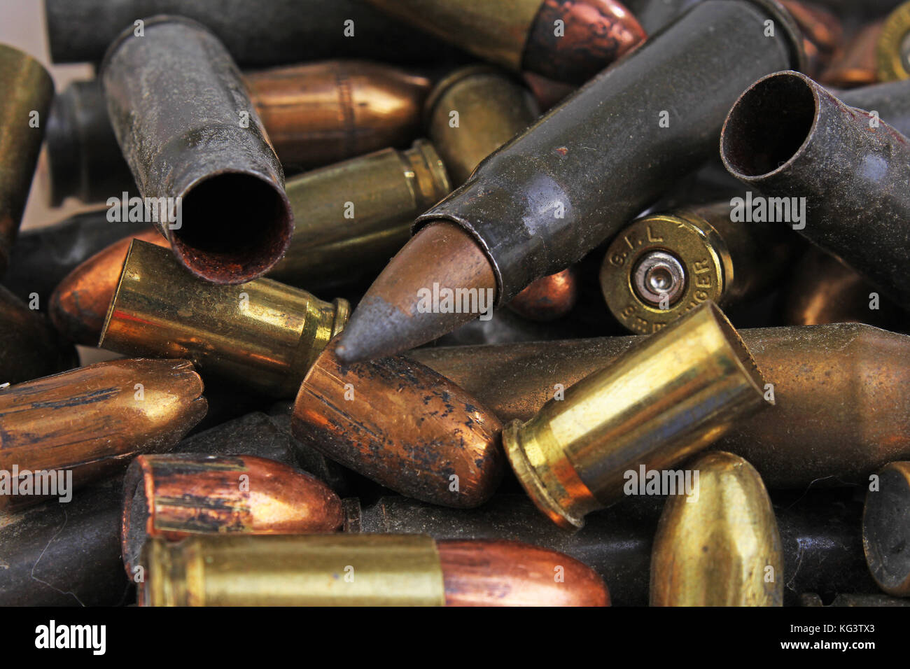 Heap of gun bullets. Weapon Cartridge case sleeve background texture, 7 ...