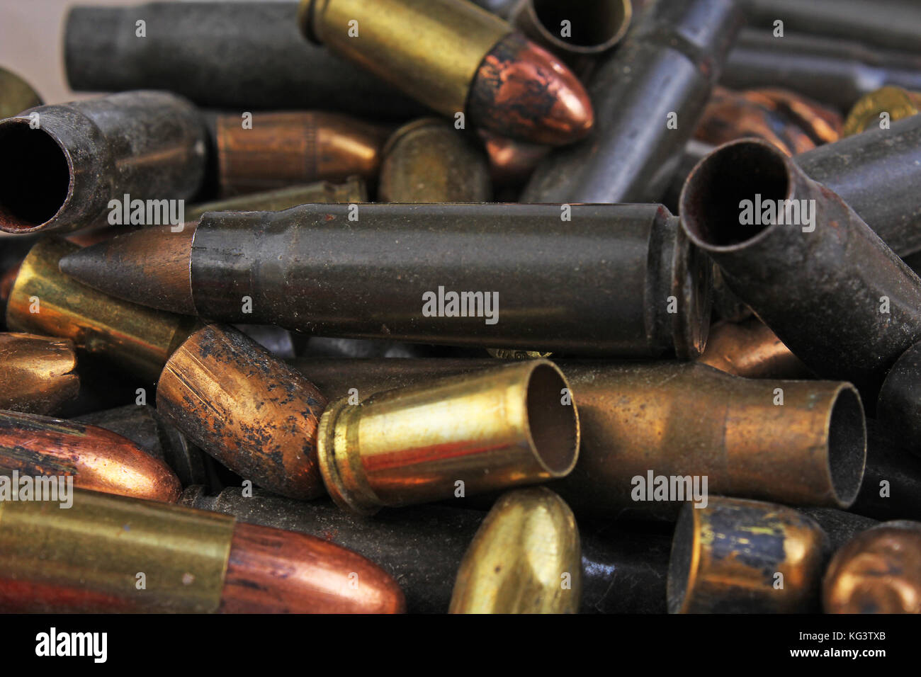 Heap of gun bullets. Weapon Cartridge case sleeve background texture, 7 ...