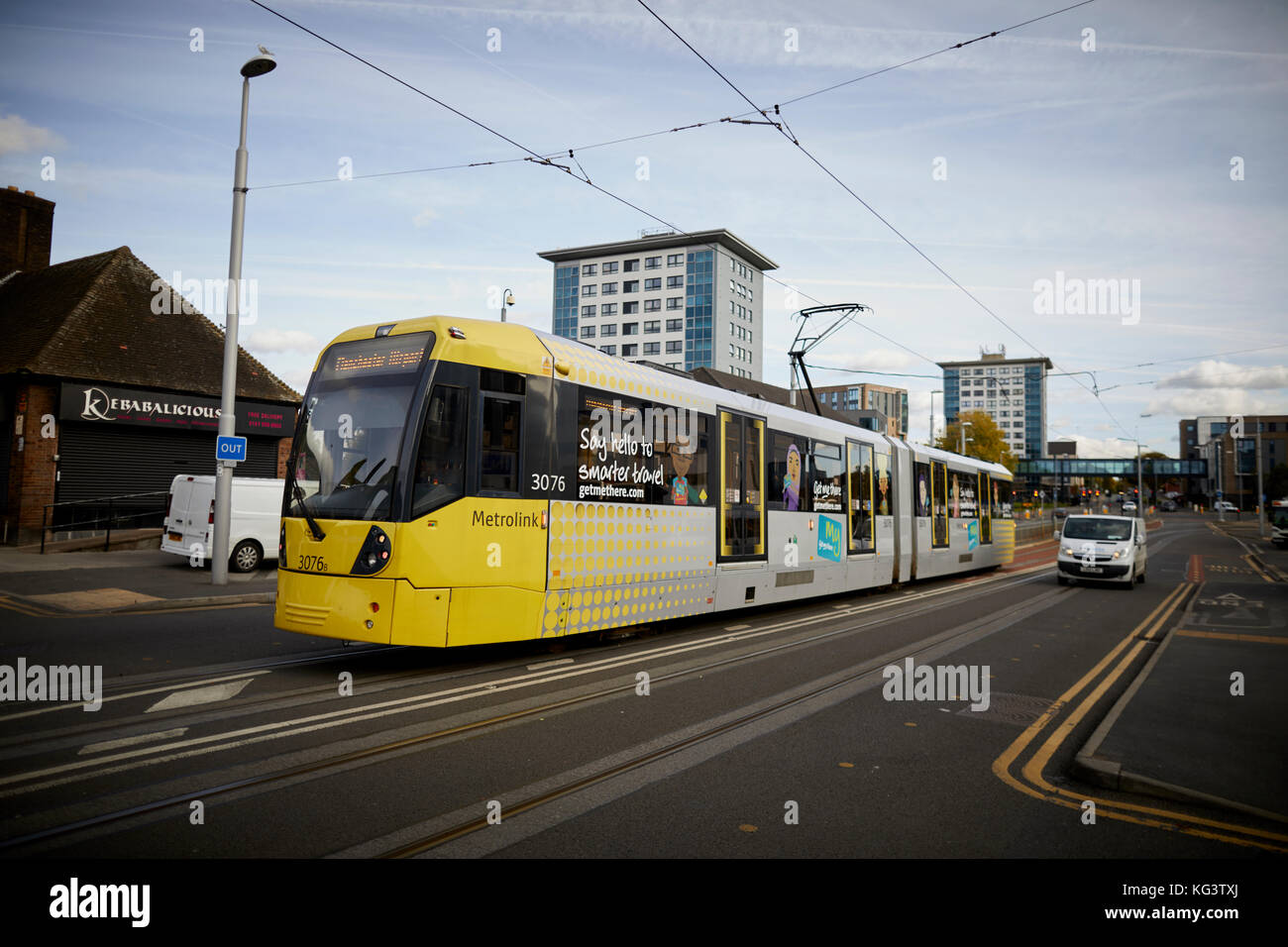 A yellow Metrolink Manchester tram at Hollyhedge Road, Benchill ...