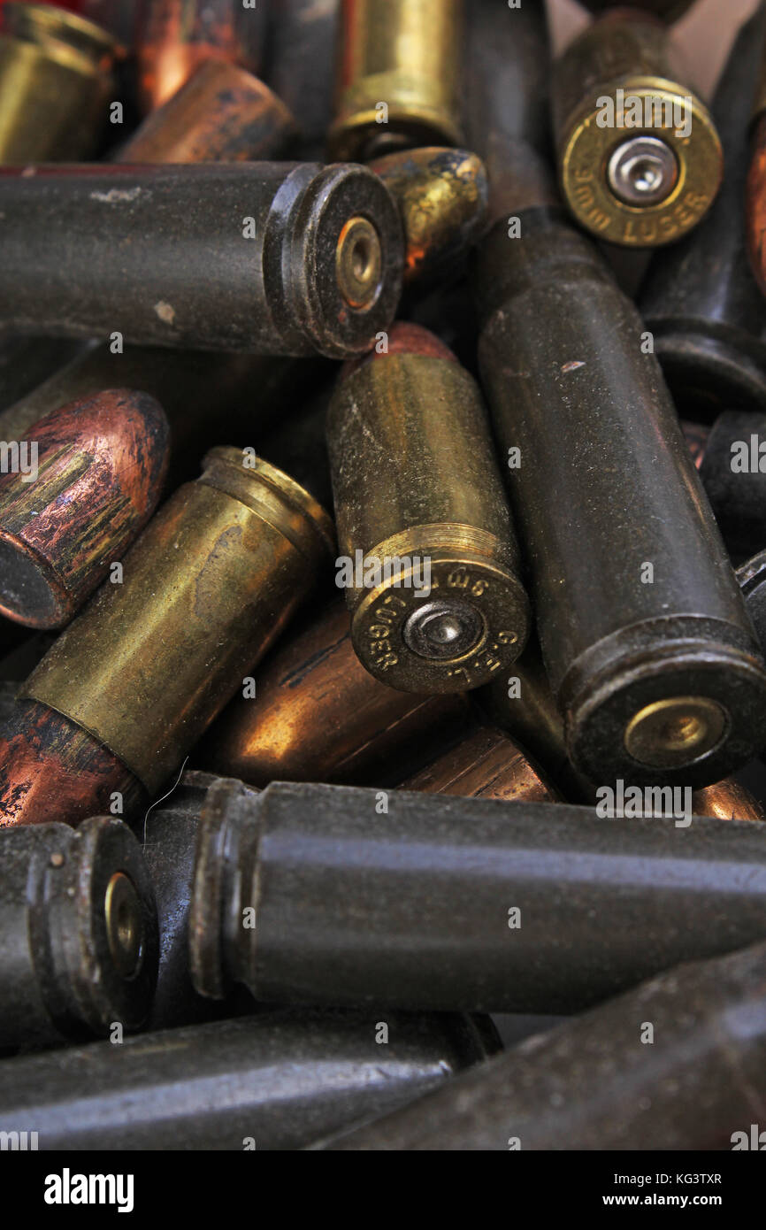 Heap of gun bullets. Weapon Cartridge case sleeve background texture, 7 ...