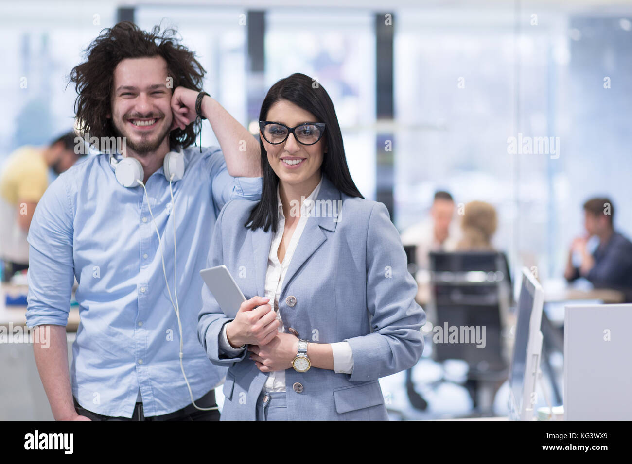business people using tablet computer while preparing for next meeting ...
