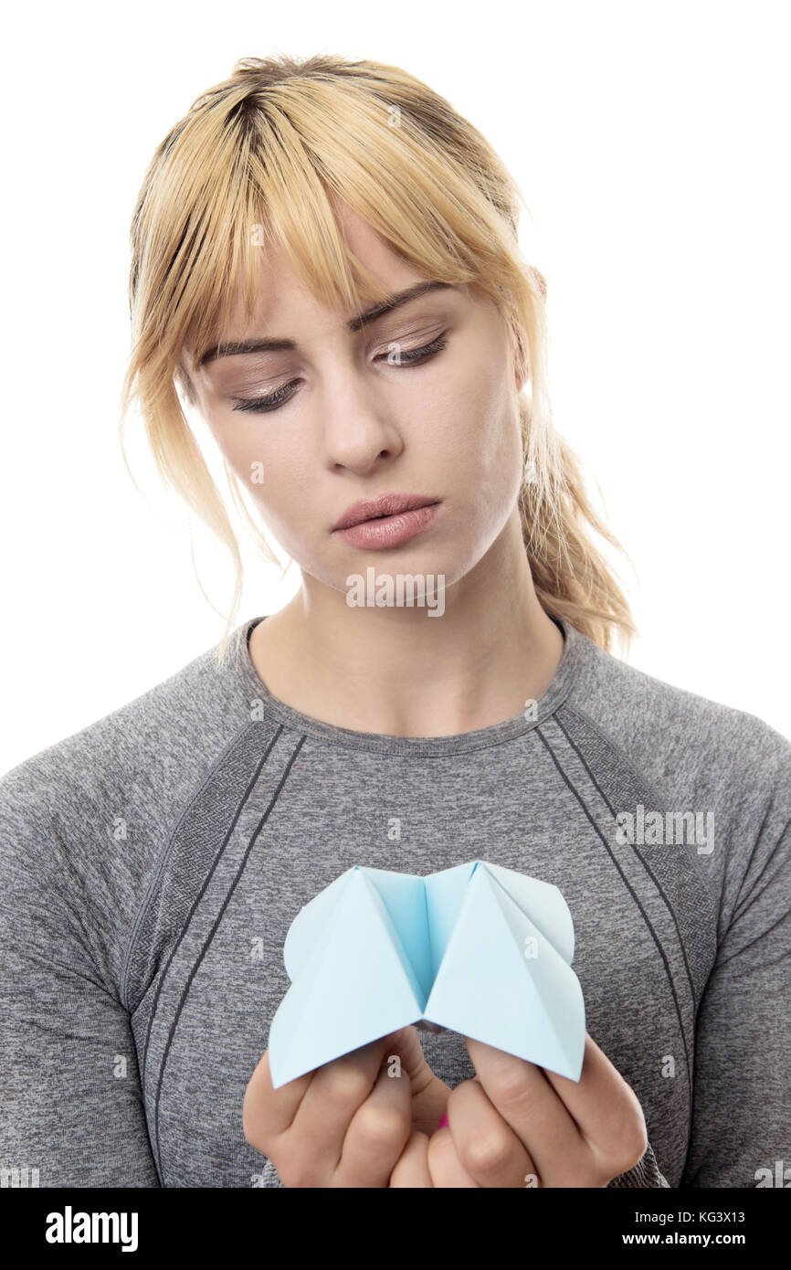 blonde haired woman woman wearing gym clothes using a origami choice ...