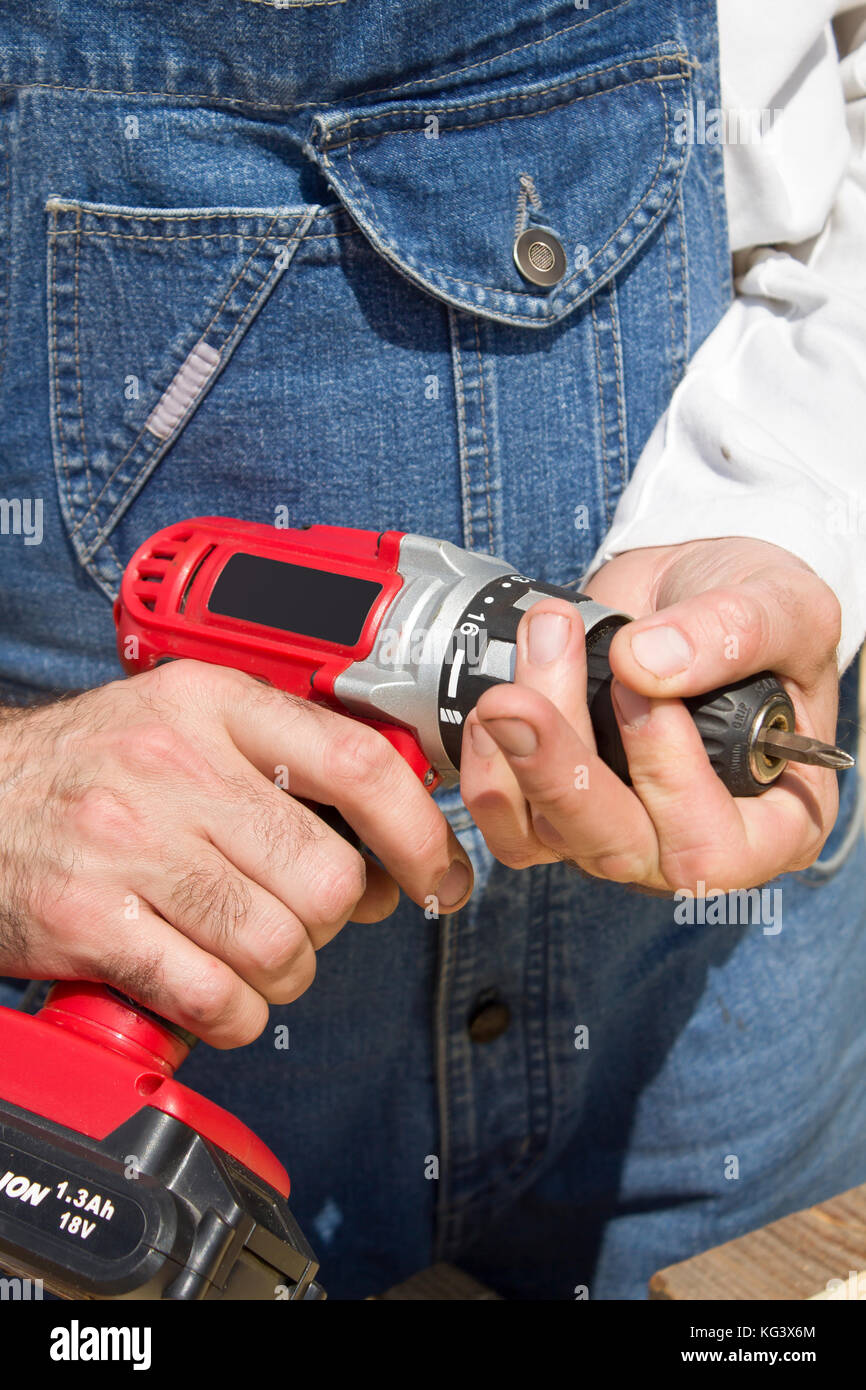 carpenter's hands changing the tip of the tip in the screwdriver The ...