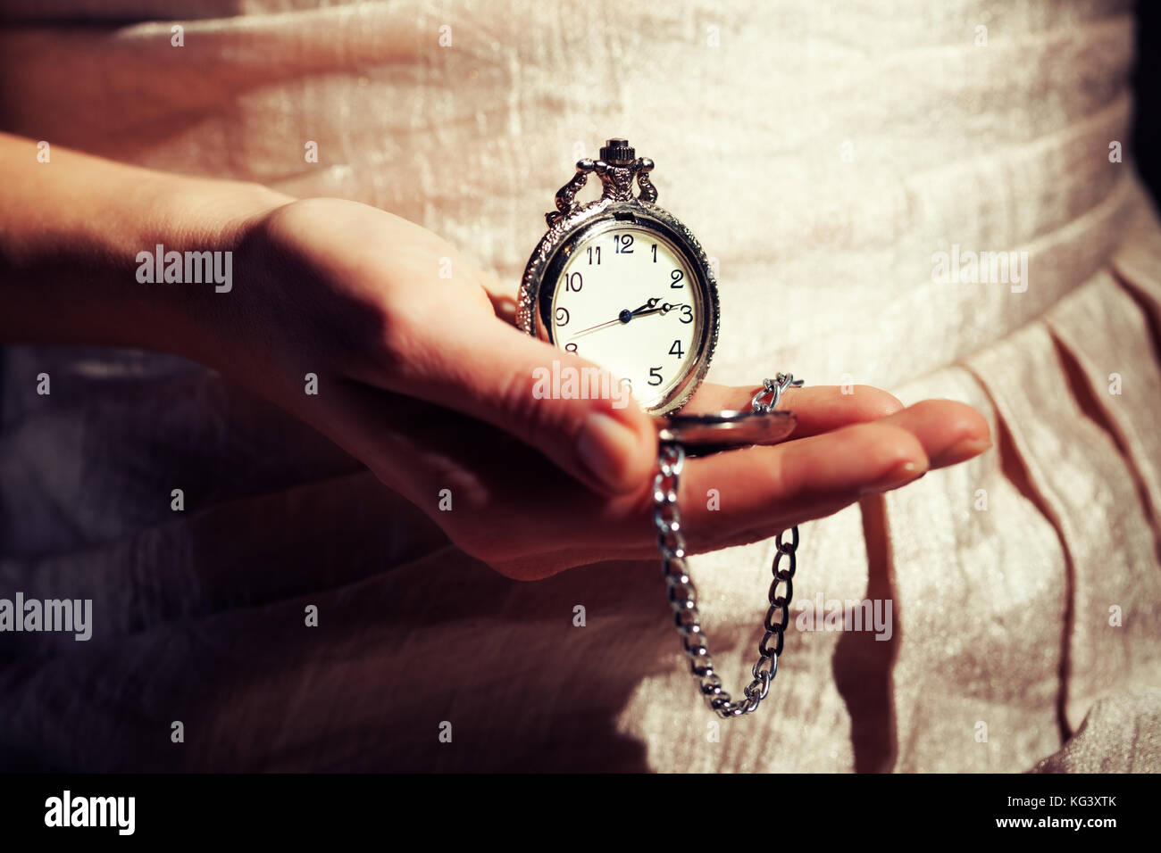 Woman holding antique watch in her hand Stock Photo - Alamy