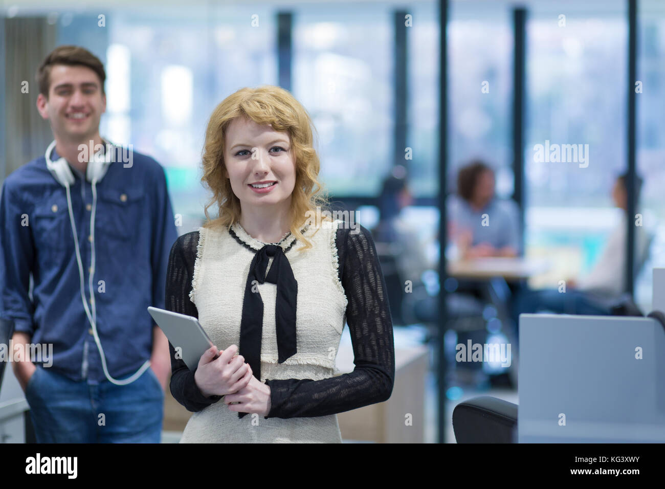 business people using tablet computer while preparing for next meeting ...
