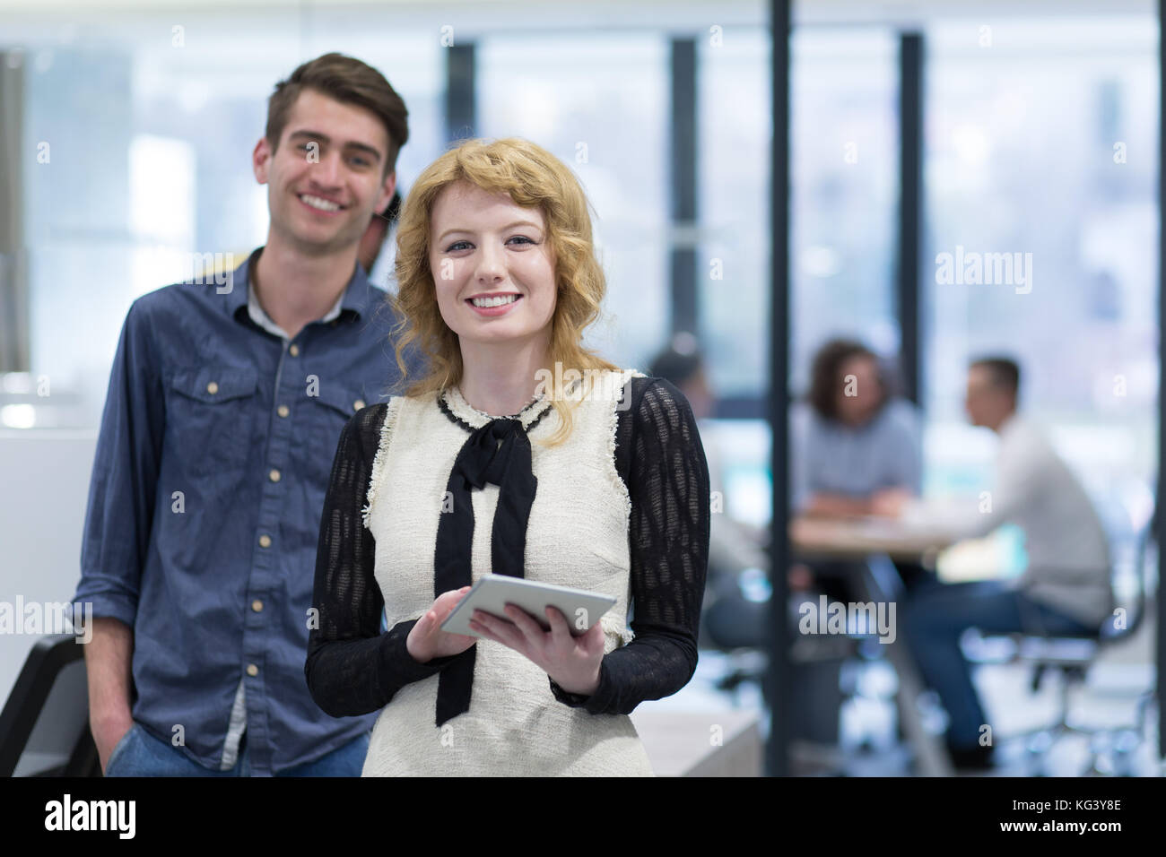 business people using tablet computer while preparing for next meeting ...
