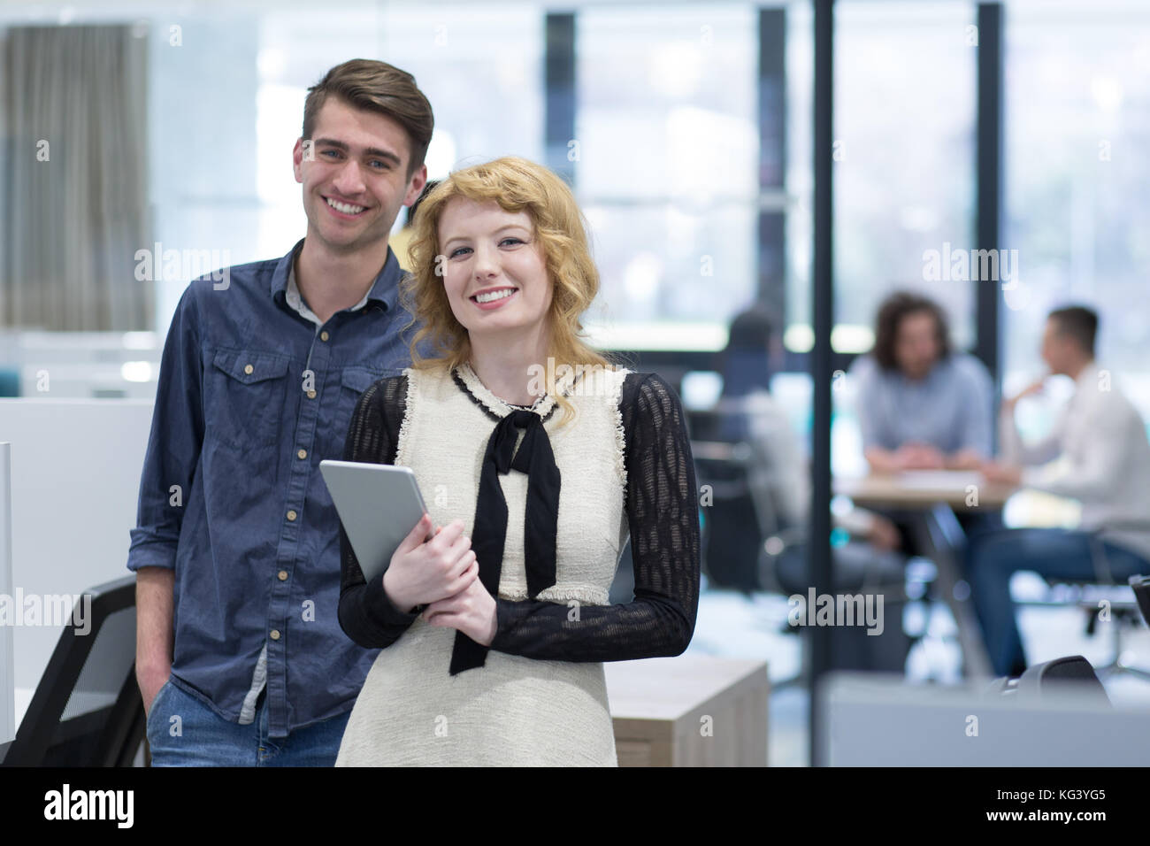 business people using tablet computer while preparing for next meeting ...