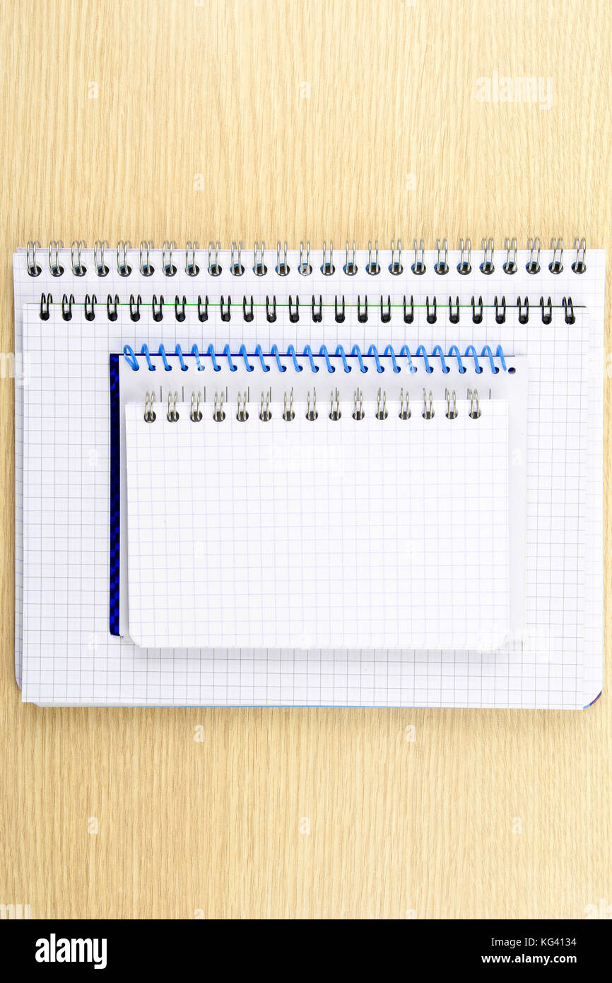 Stack of notebooks on a table Stock Photo - Alamy