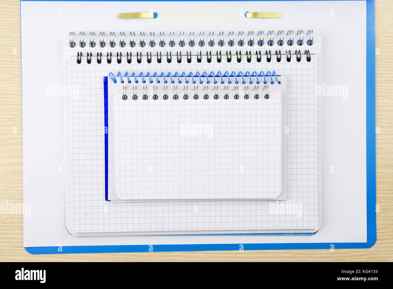 Stack of notebooks on a table Stock Photo - Alamy