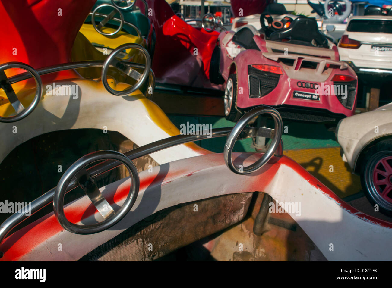 Empty cars used for rides at a children's amusement park stand empty on ...