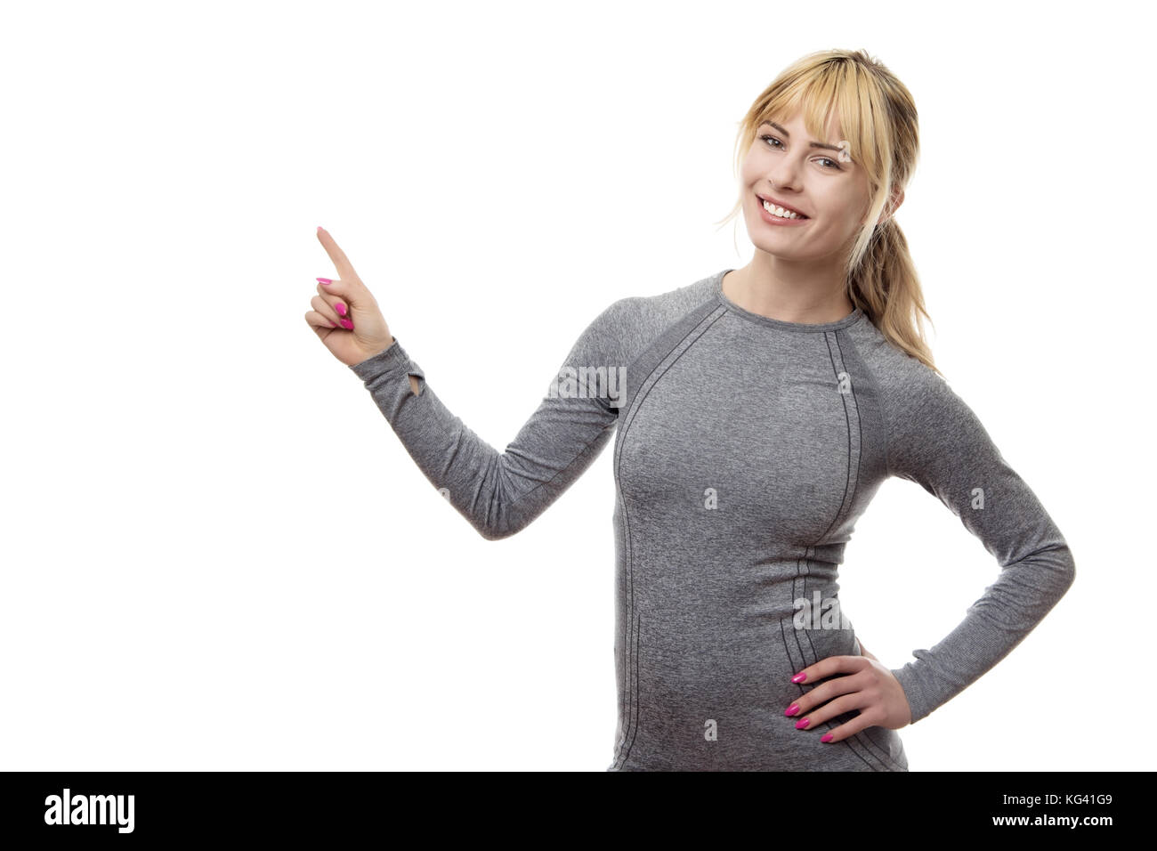 Blonde girl pointing something finger hi-res stock photography and ...