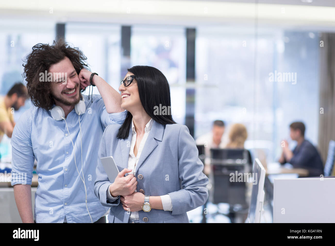 business people using tablet computer while preparing for next meeting ...