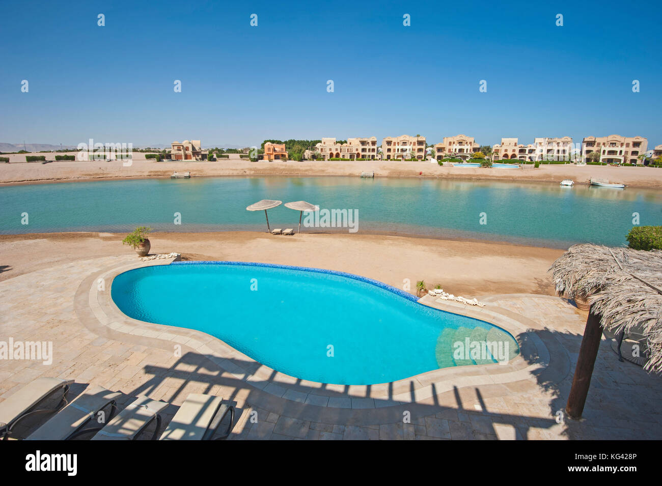Luxury villa show home in tropical summer holiday resort with swimming ...