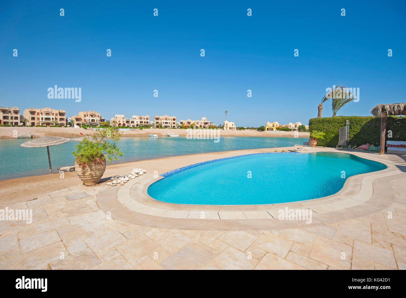 Luxury villa show home in tropical summer holiday resort with swimming ...