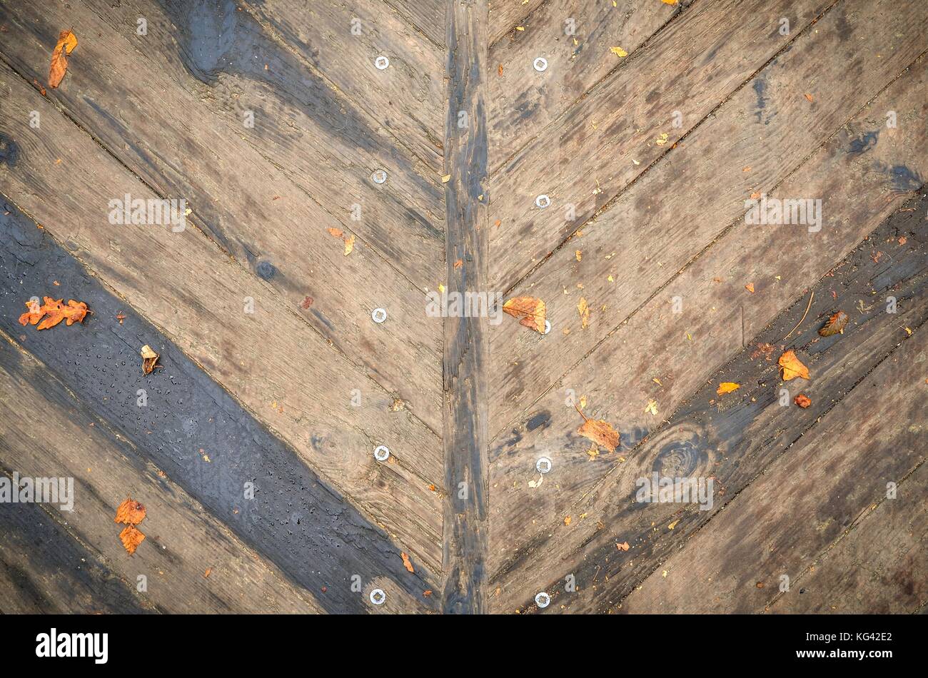 Brown wooden background. Natural planks with autumn leaves Stock Photo ...