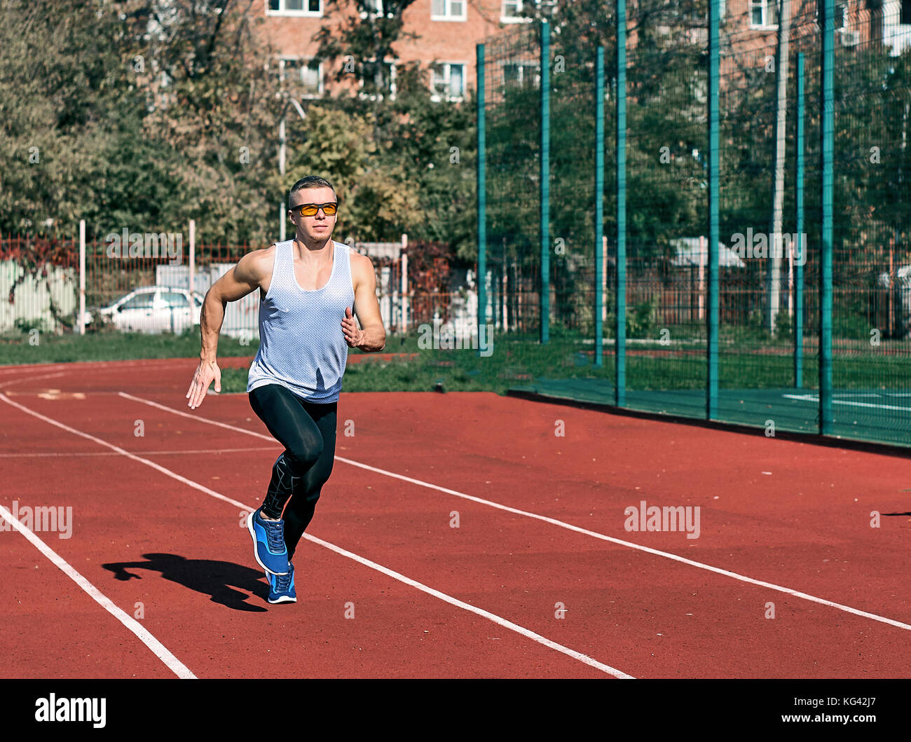 athlete running in the stadium Stock Photo - Alamy