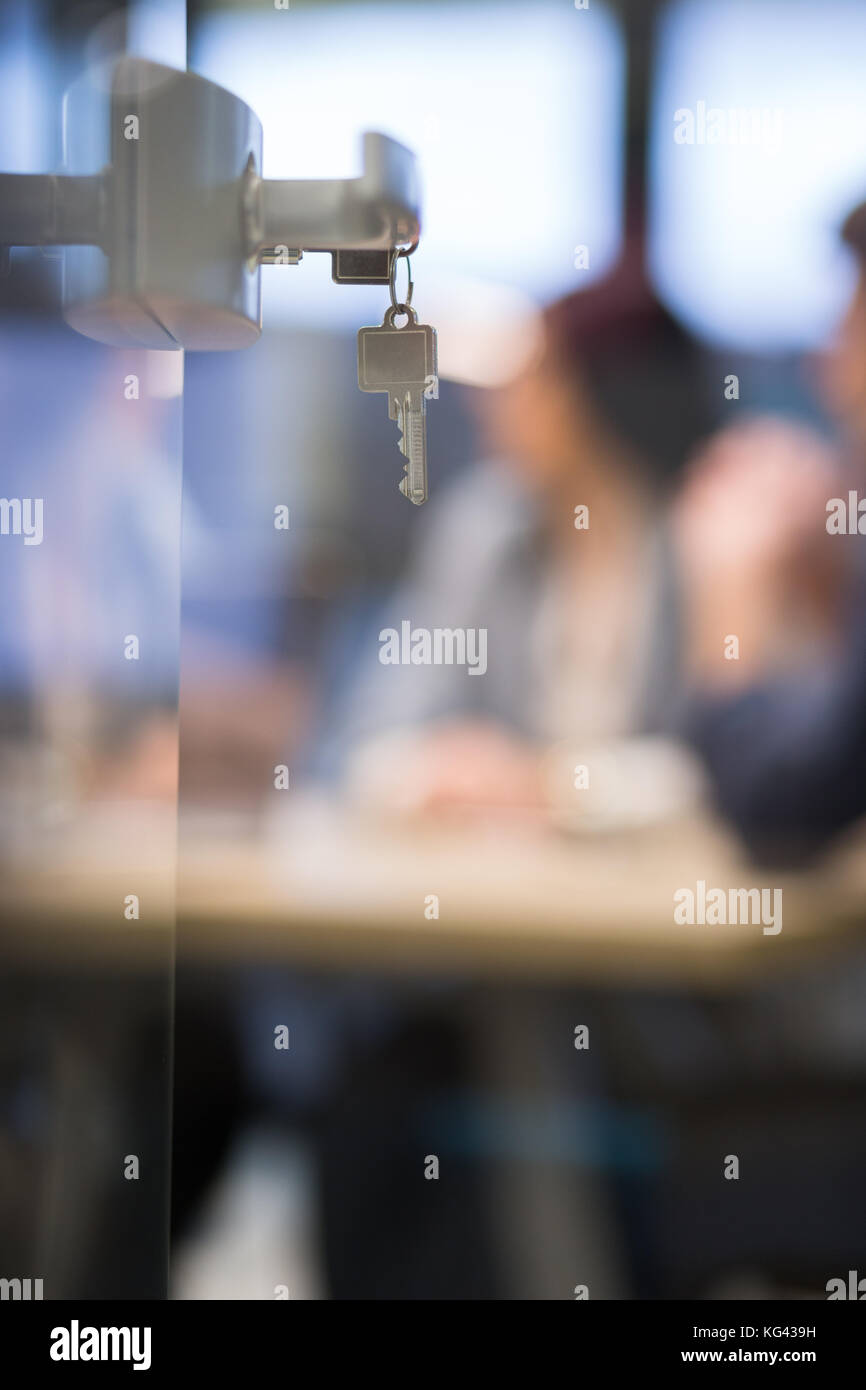 Open glass door with keys, key in keyhole Stock Photo - Alamy