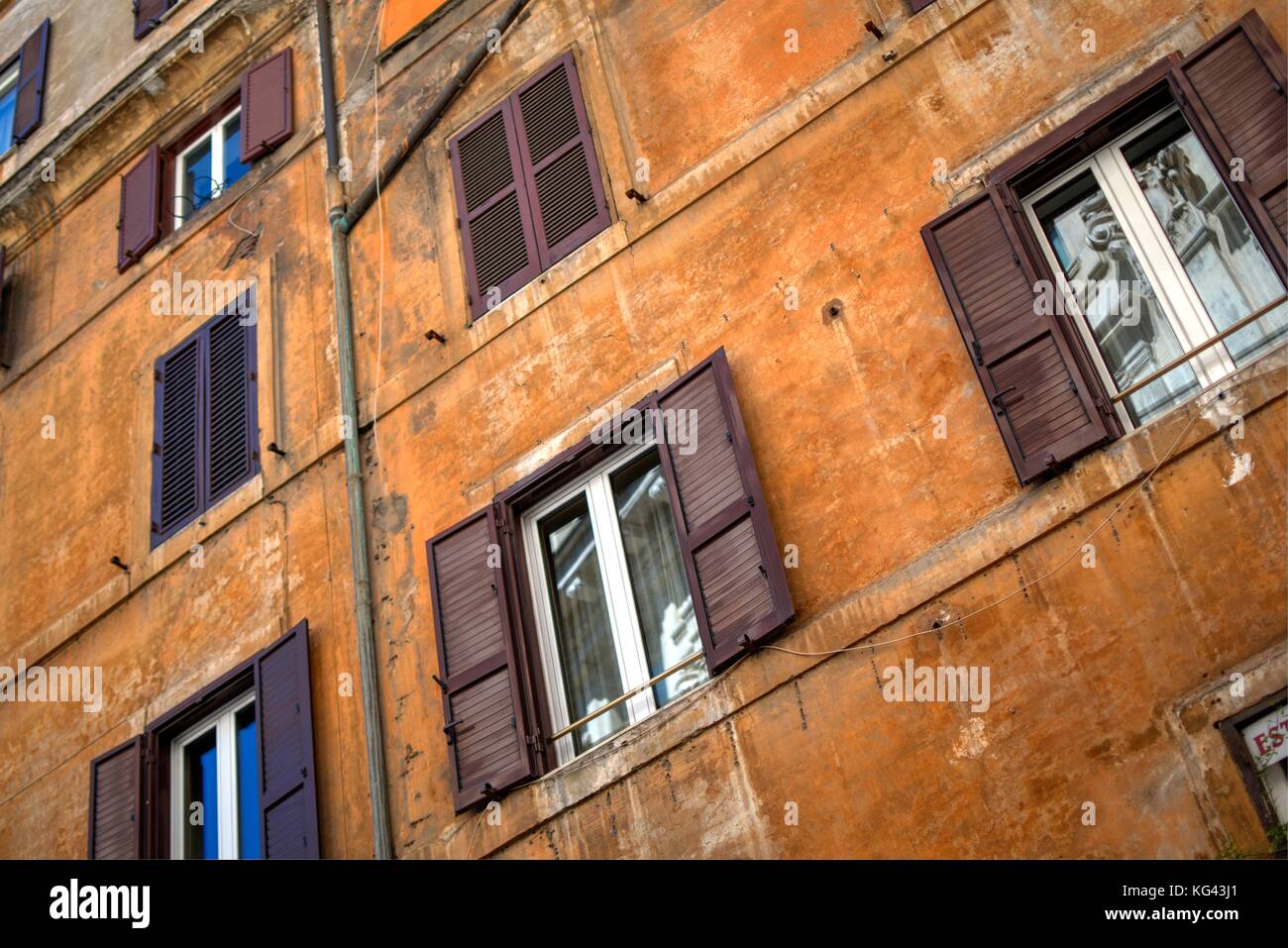 Vintage facade of apartment block in Rome, Italy, with windows and ...