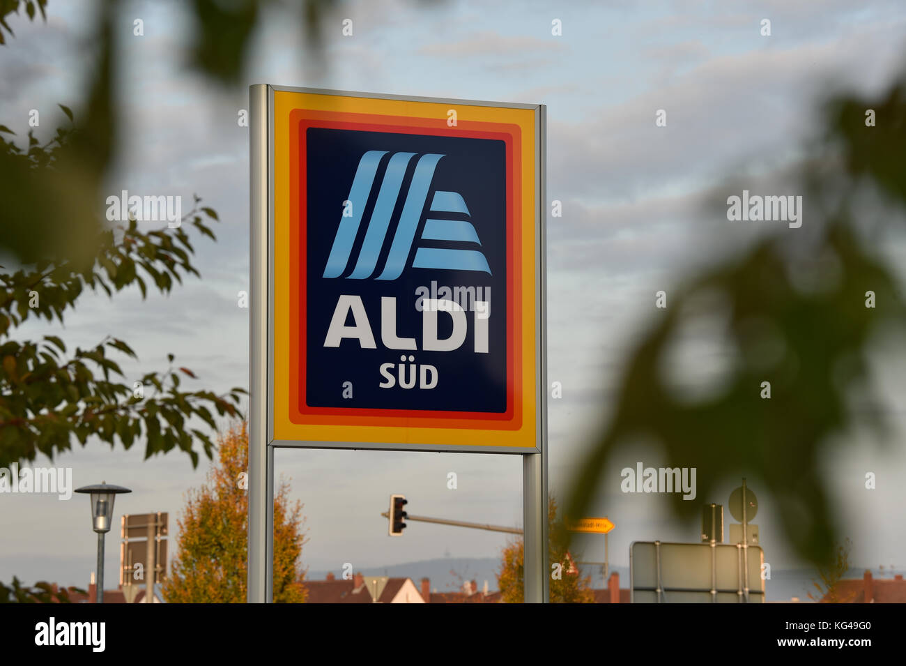 A sign with the new logo of the discount store Aldi placed in front of ...
