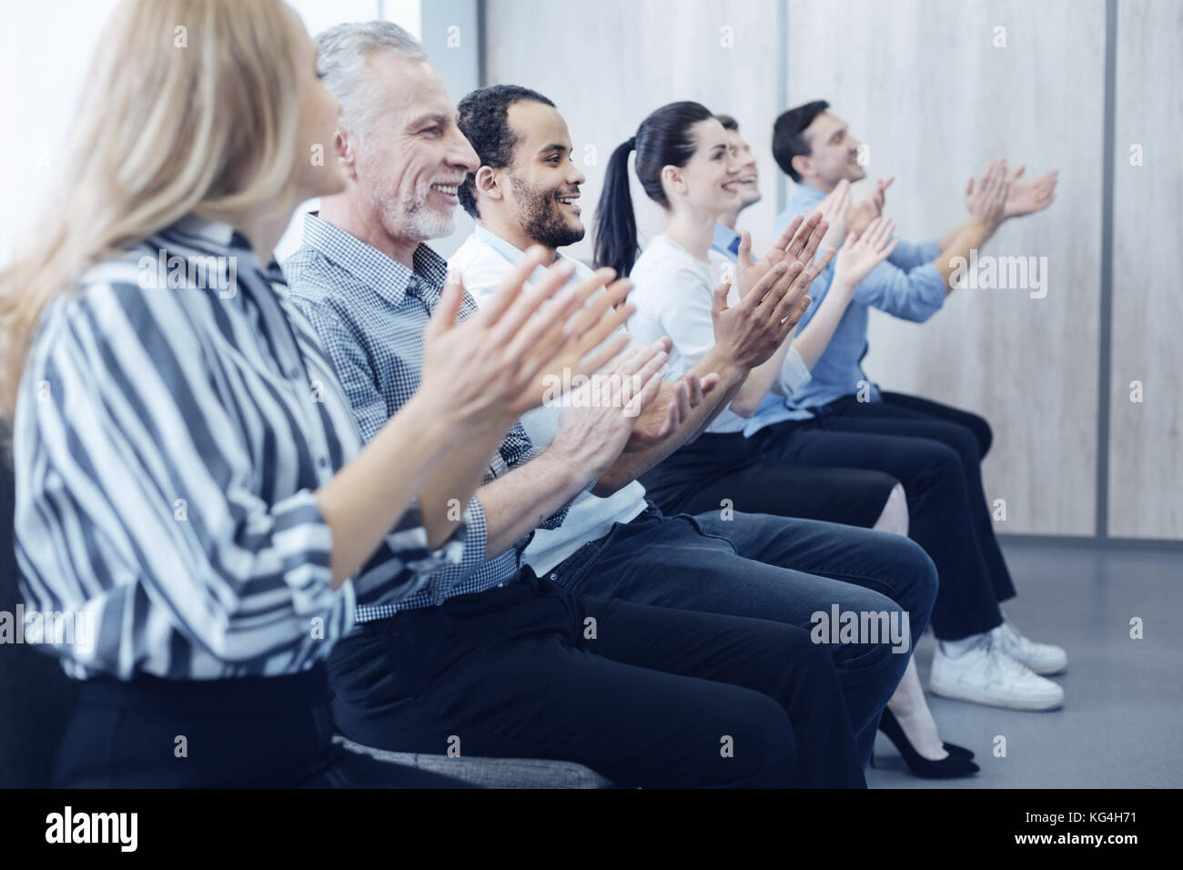 Delighted people feeling happiness at training Stock Photo - Alamy